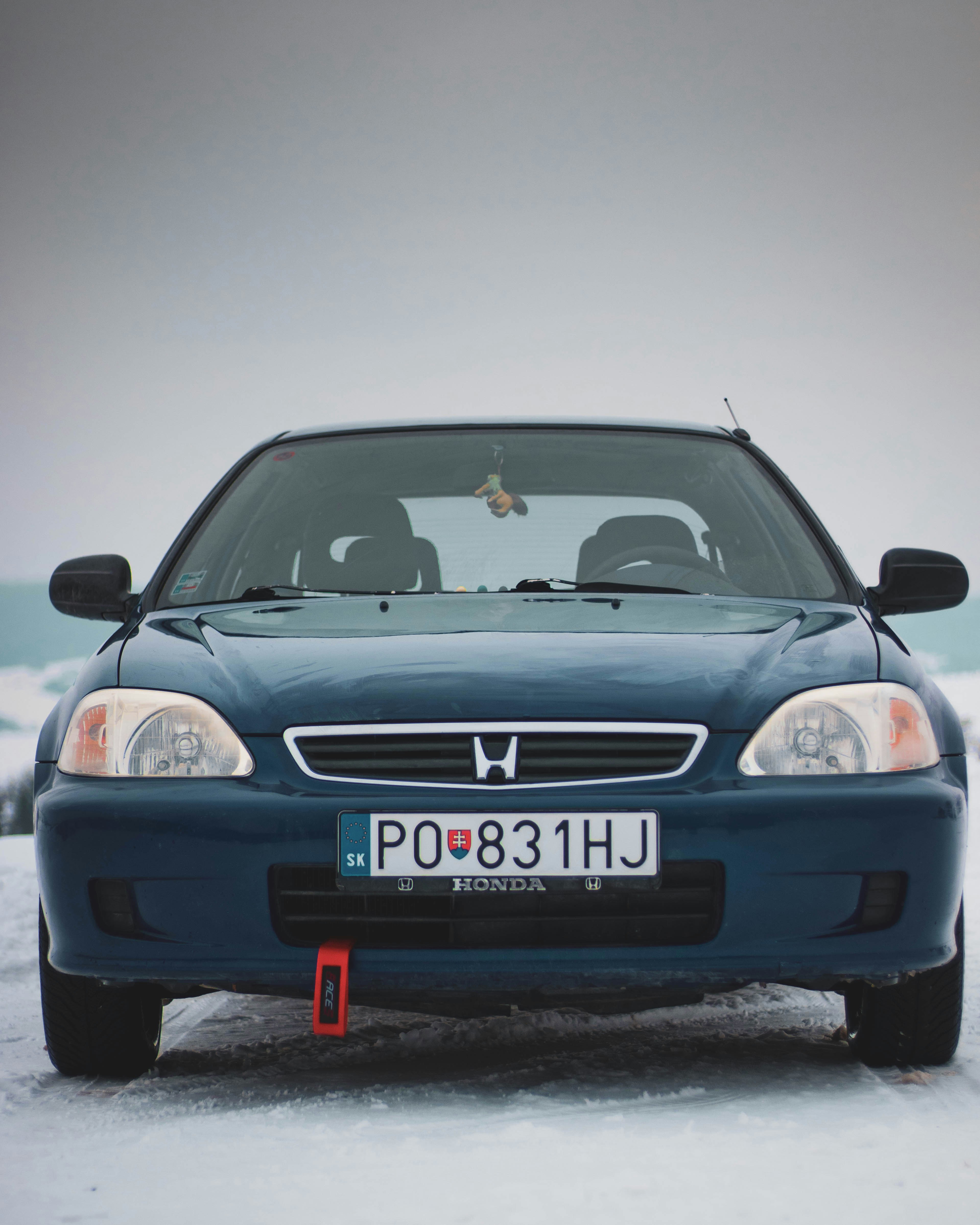 Front-Quarter of a Blue Honda on Snow
