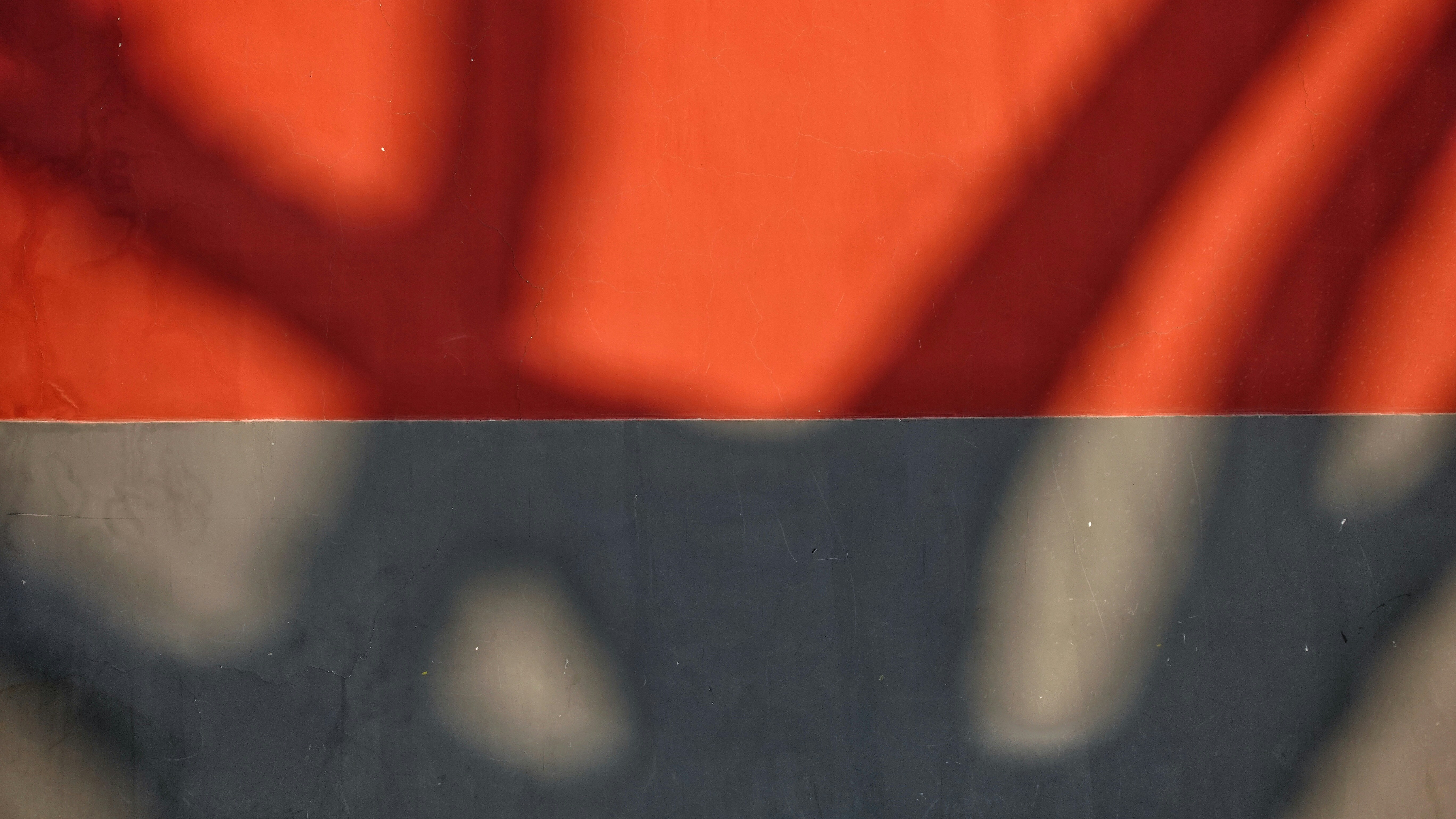 Sunlit Graffiti Edge: Abstract Warmth Across a Split Wall
