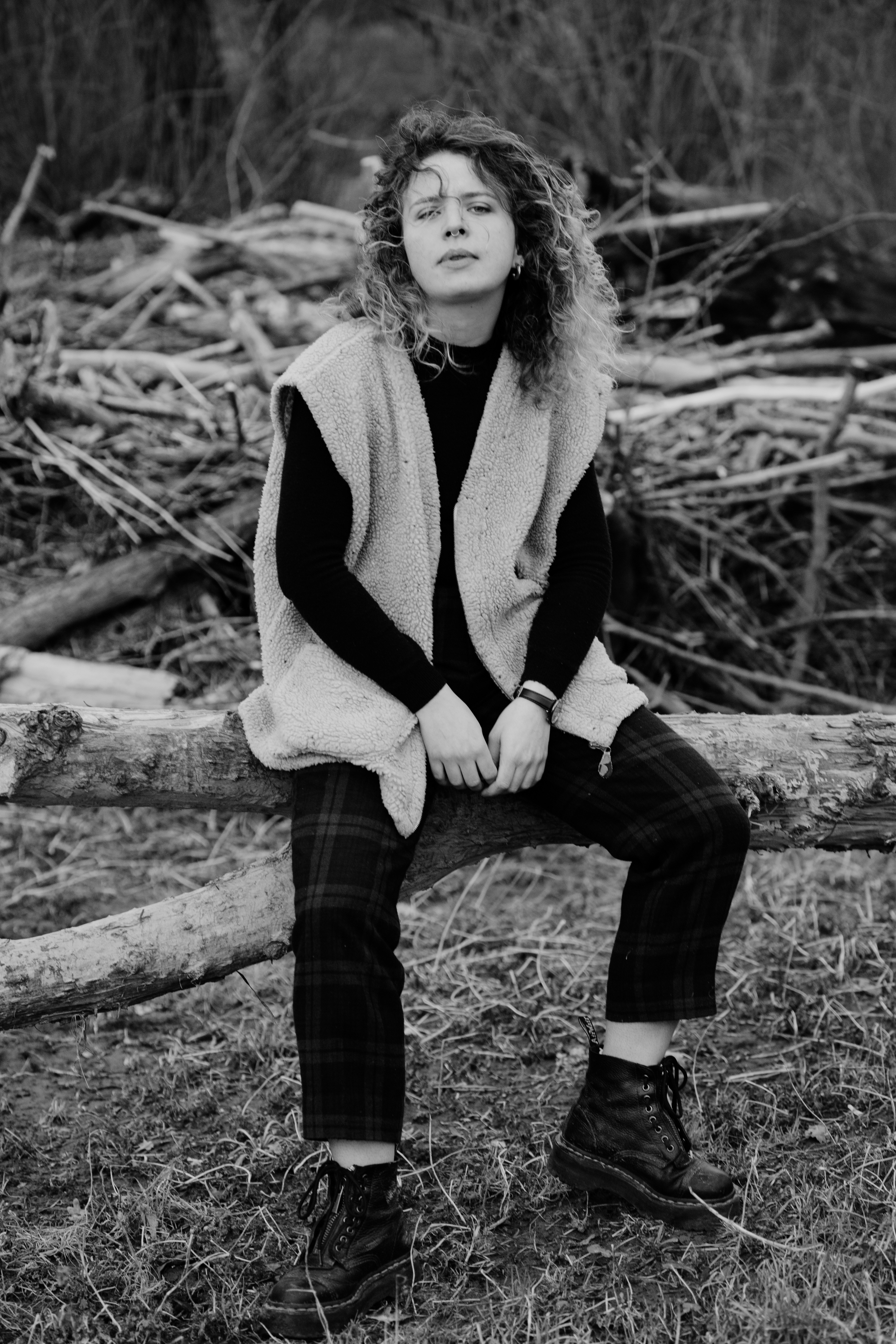 Gaze Between Logs: A Mono Portrait in Quiet Wilderness