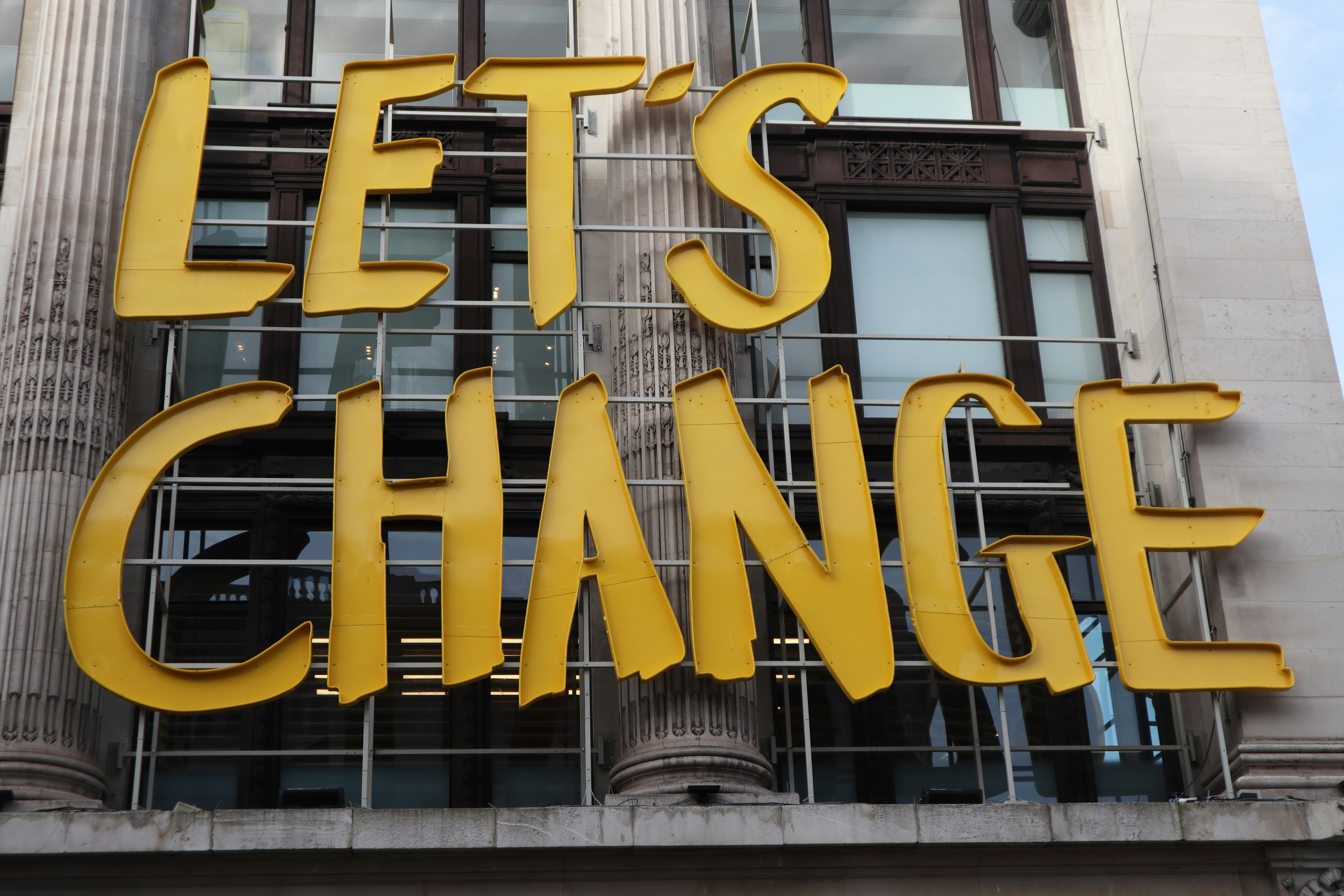 A sign that says let's change on a building photo – Free Alphabet Image ...