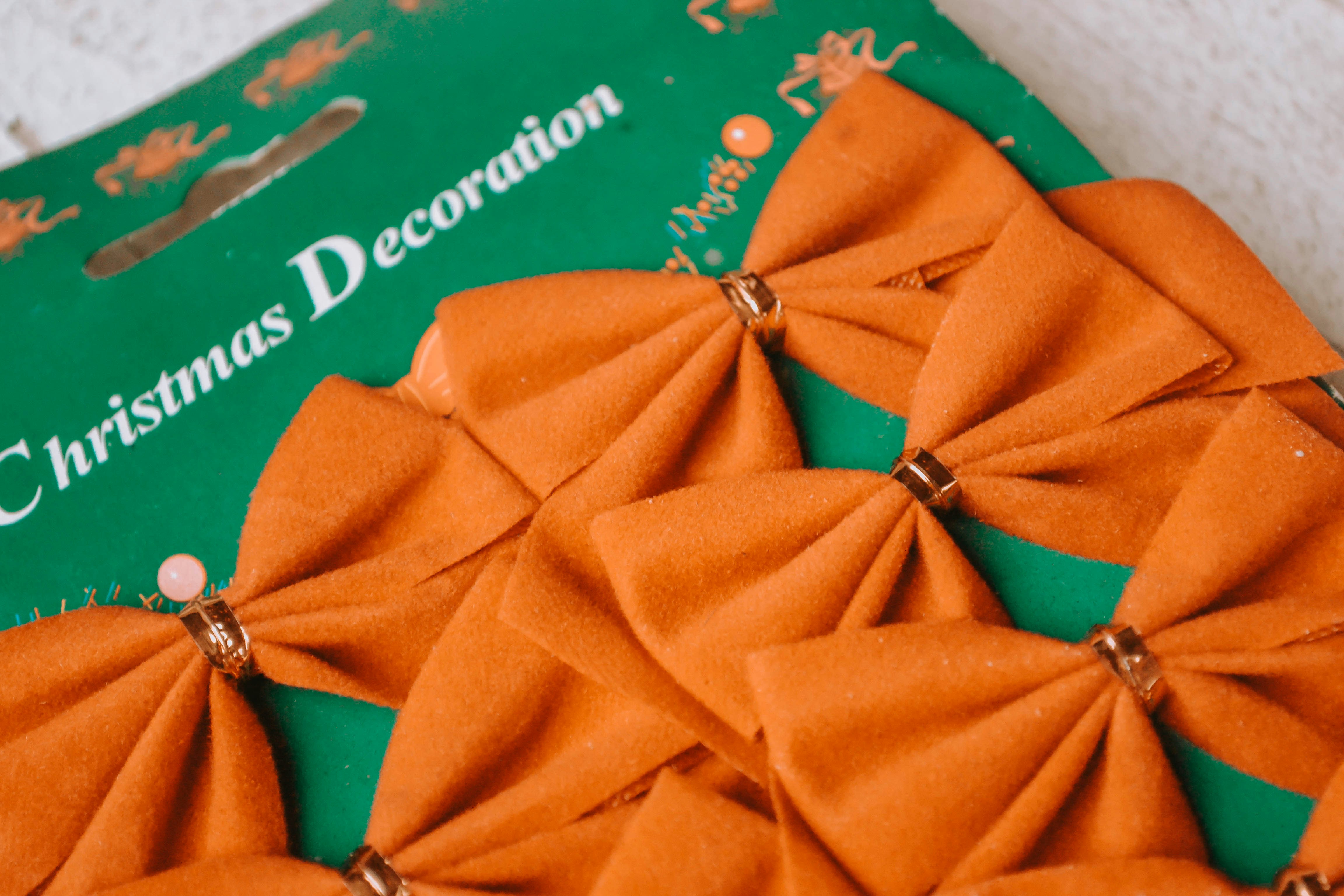 Kaleidoscope of Orange Bows on a Green Christmas Card