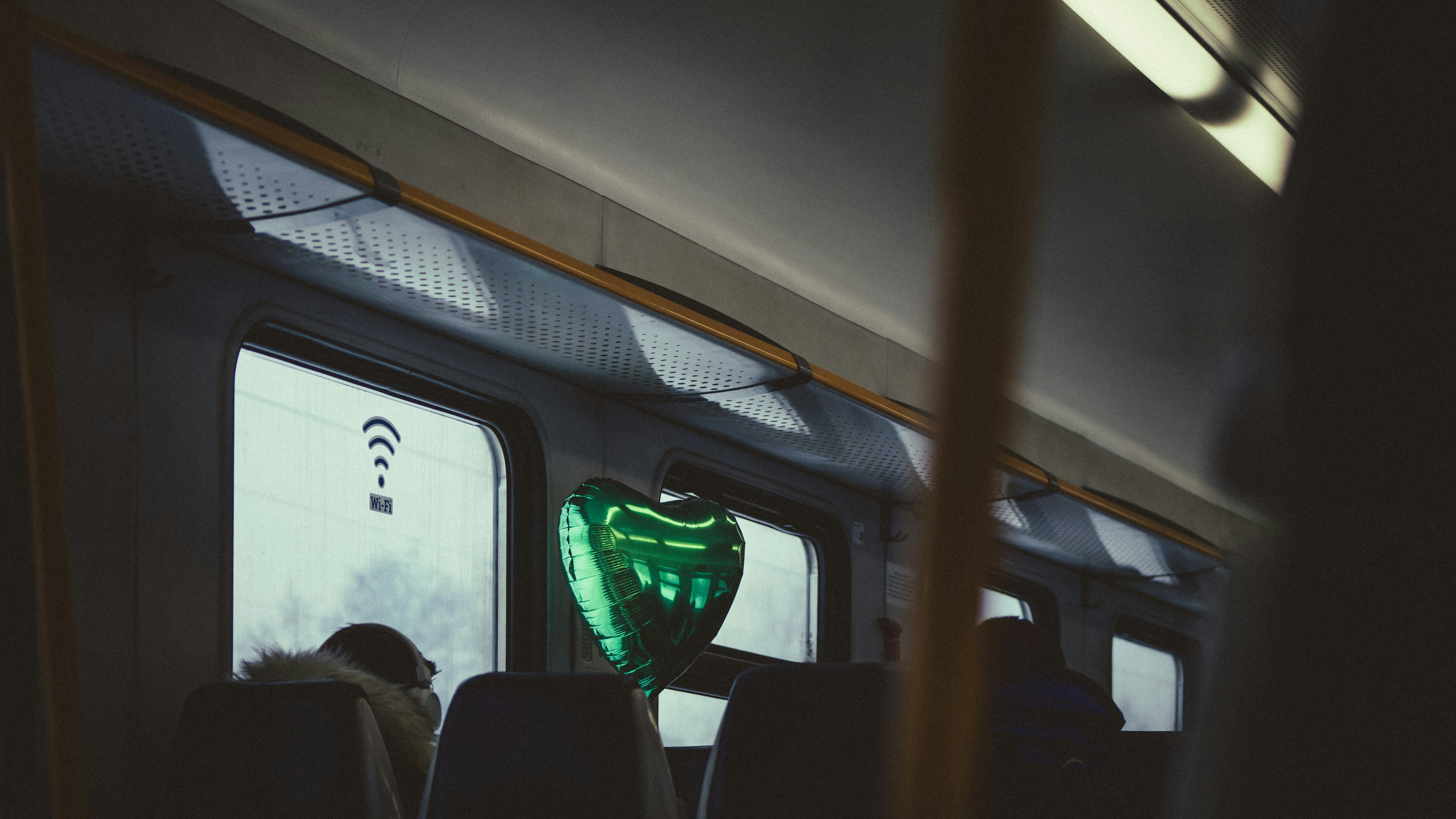 people sitting inside train during daytime