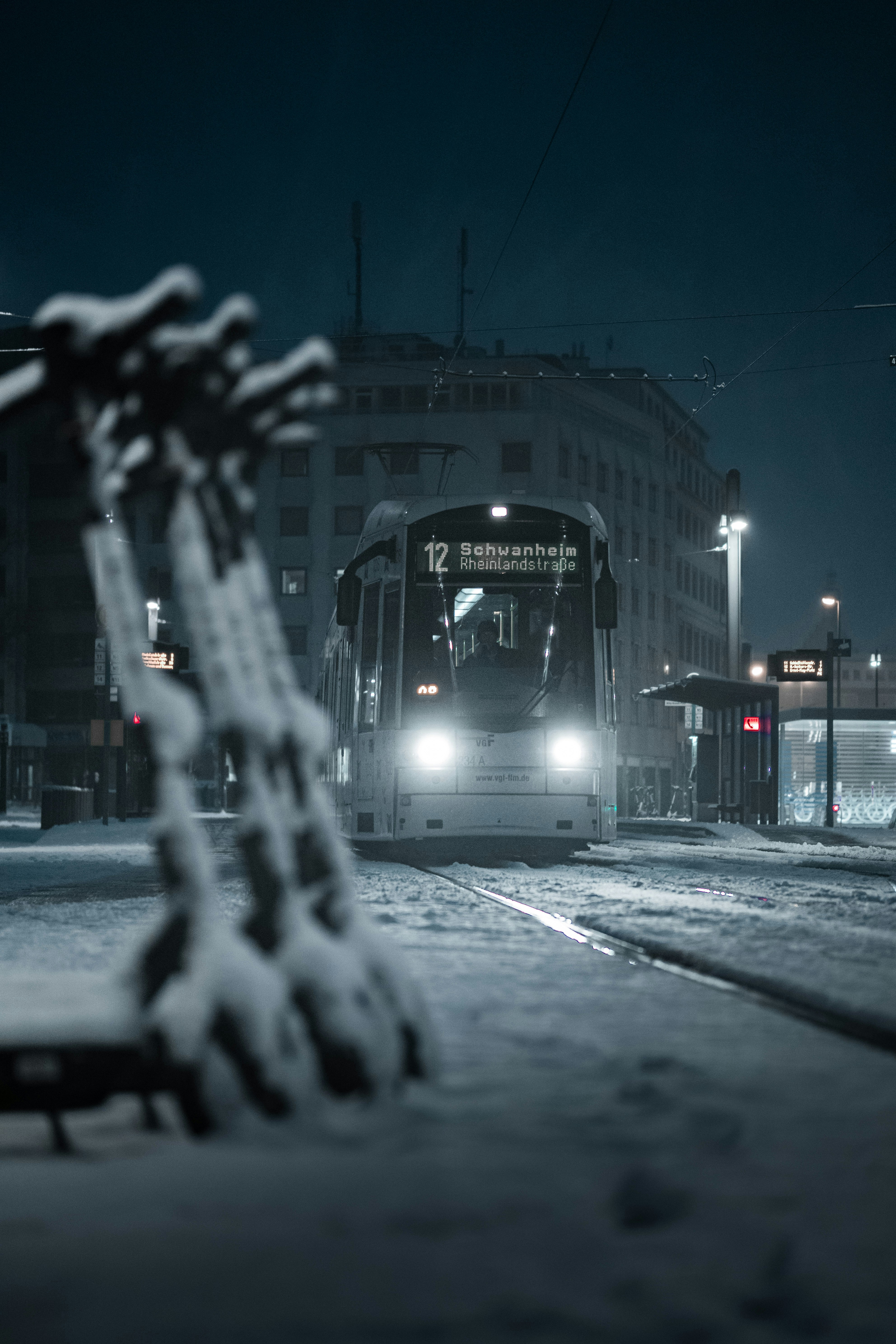 Blue-Shift Tram Approach Through Snowy Streets