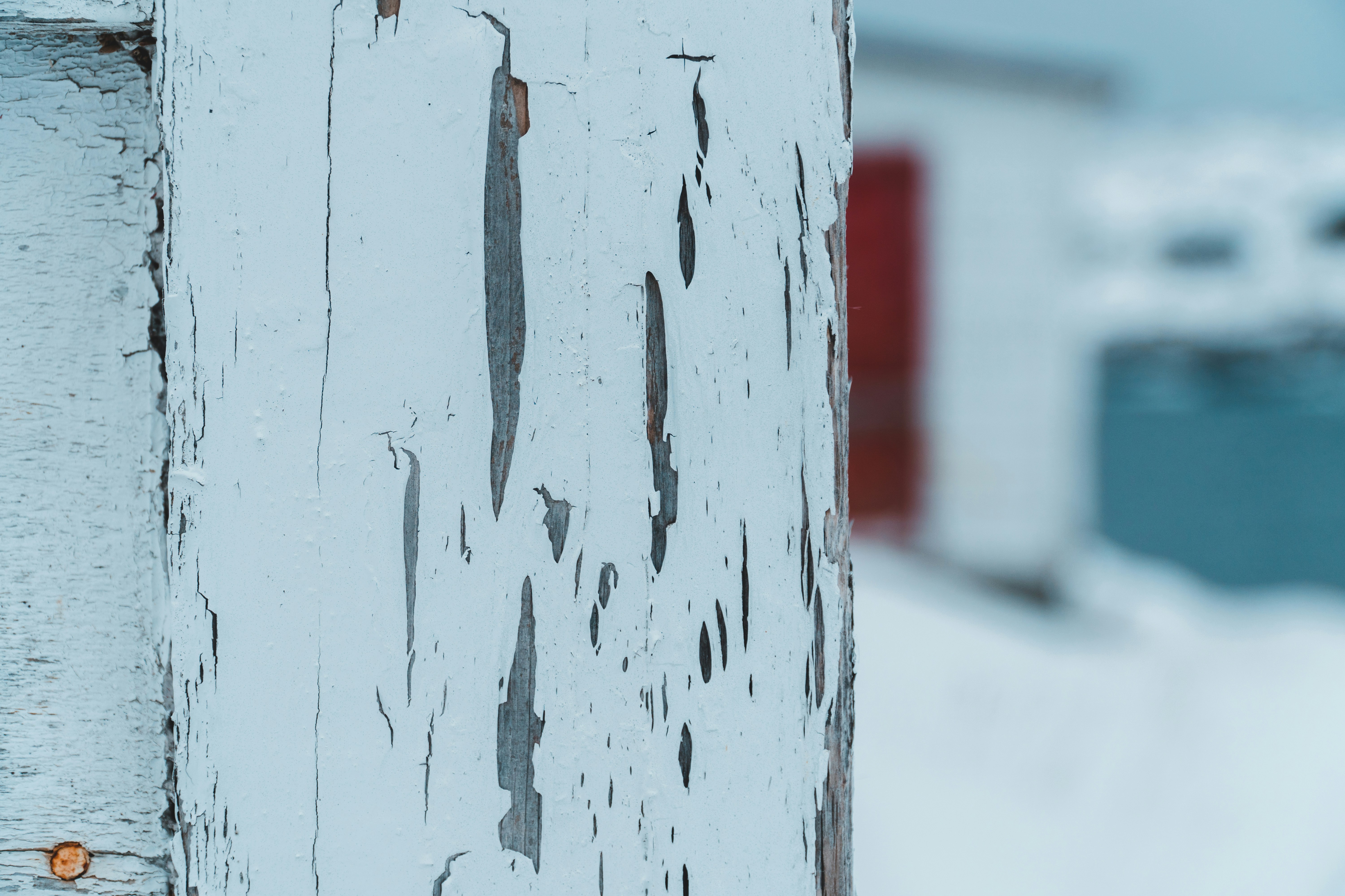 Peeling Blue Paint on a Weathered Post