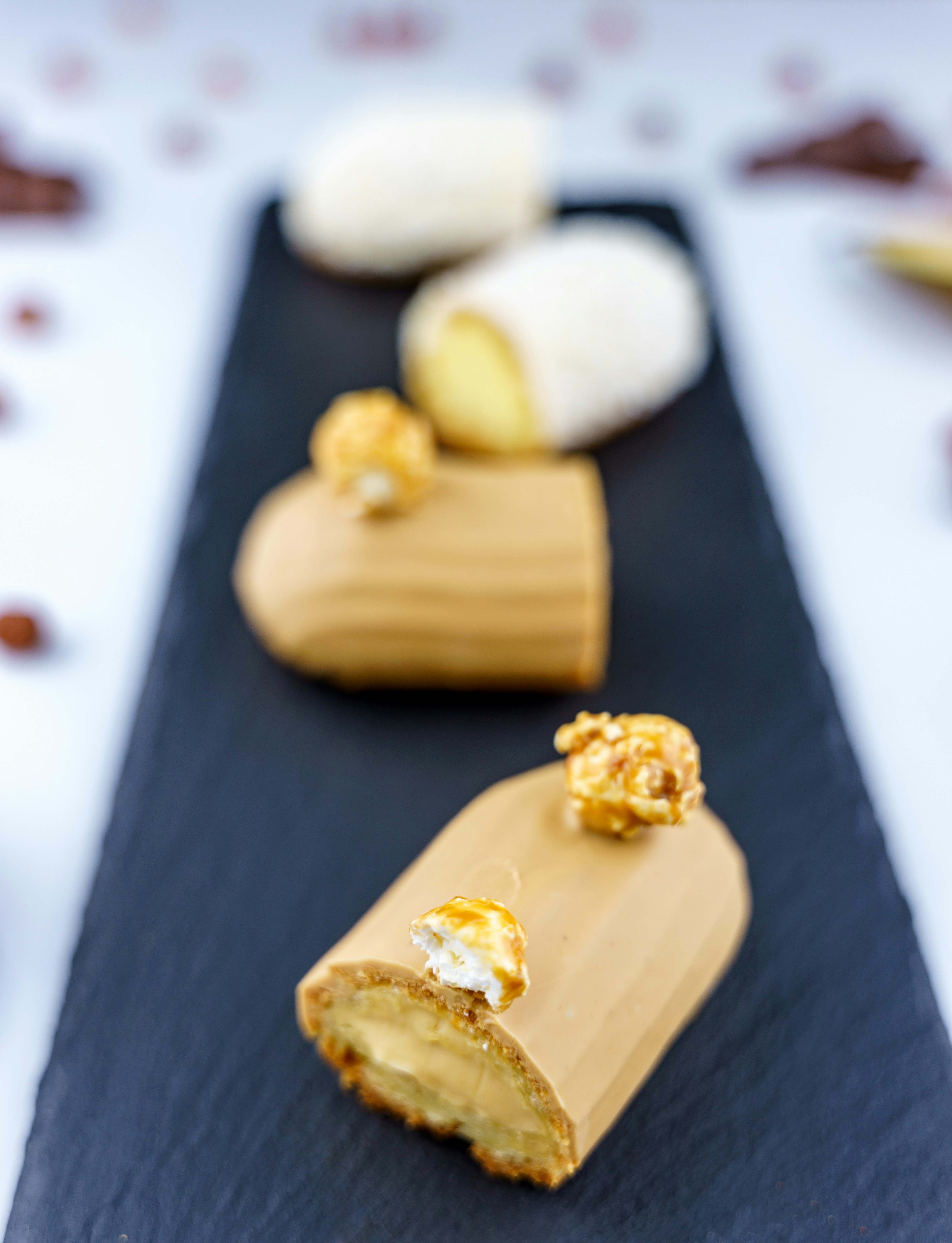 Caramel Éclairs on a Slate Ribbon
