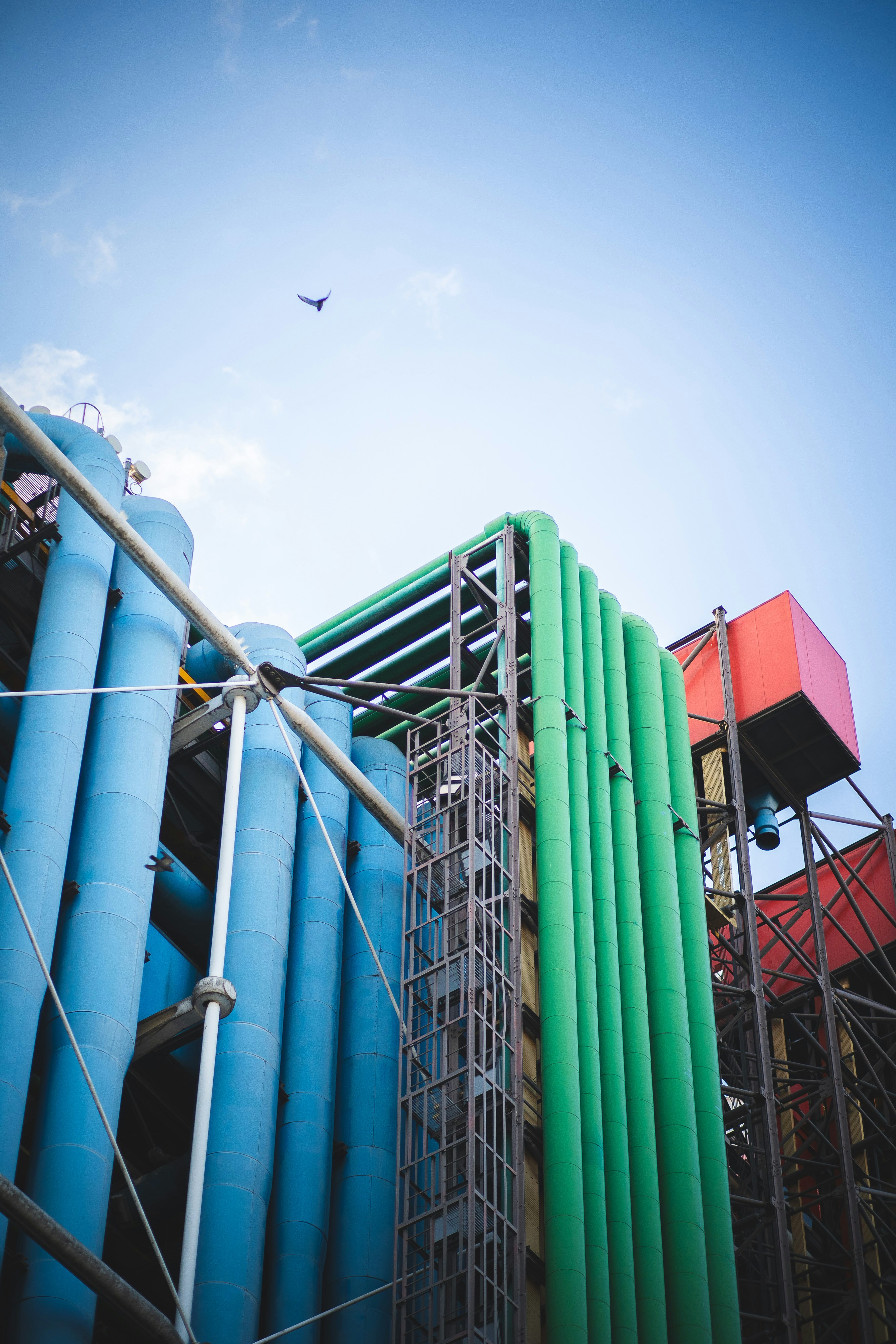Industrial rainbows: a city of color and steel against a crisp sky