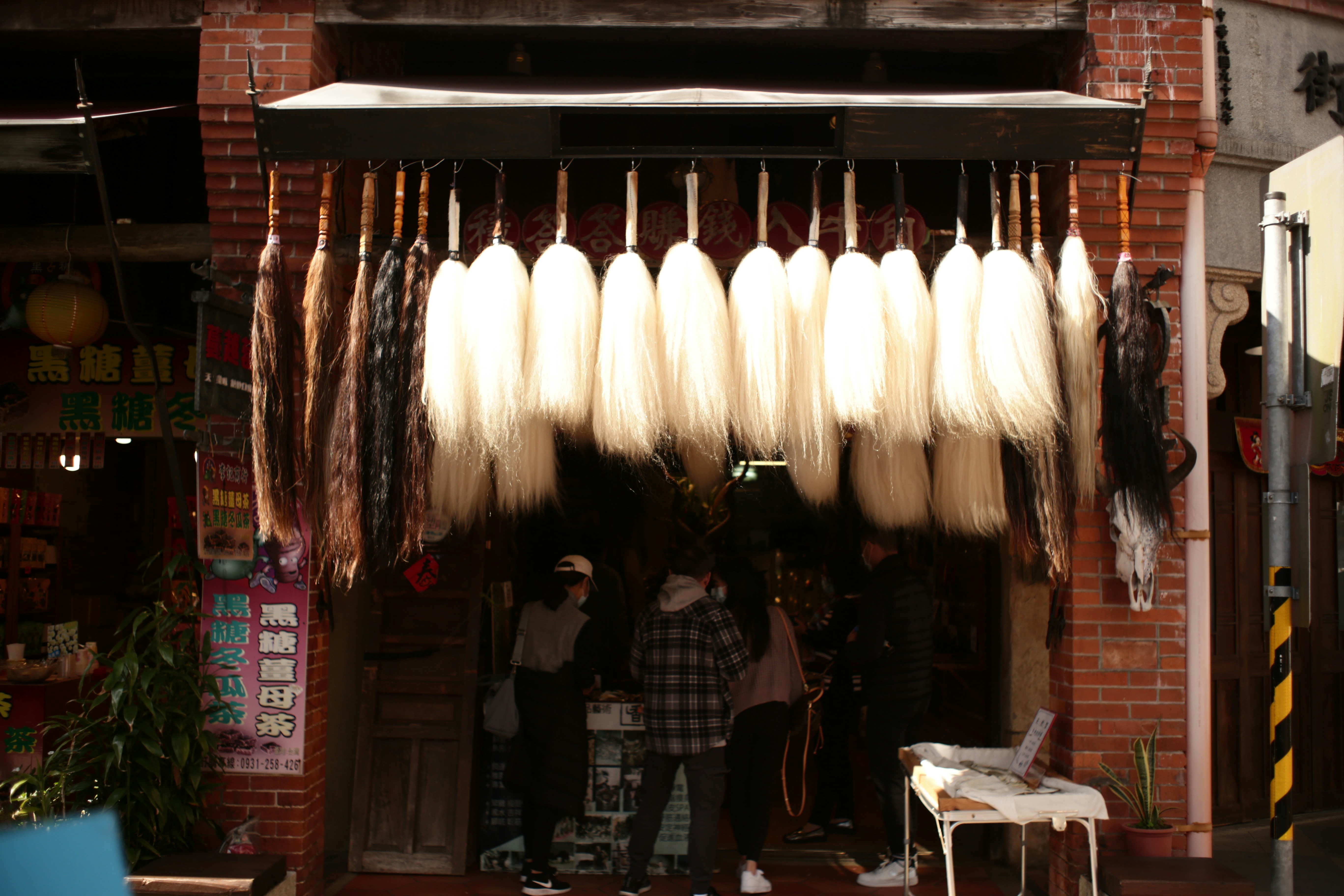 Ivory Pelts Over a Brick Market Entrance: A Window into a Local Fur Stall