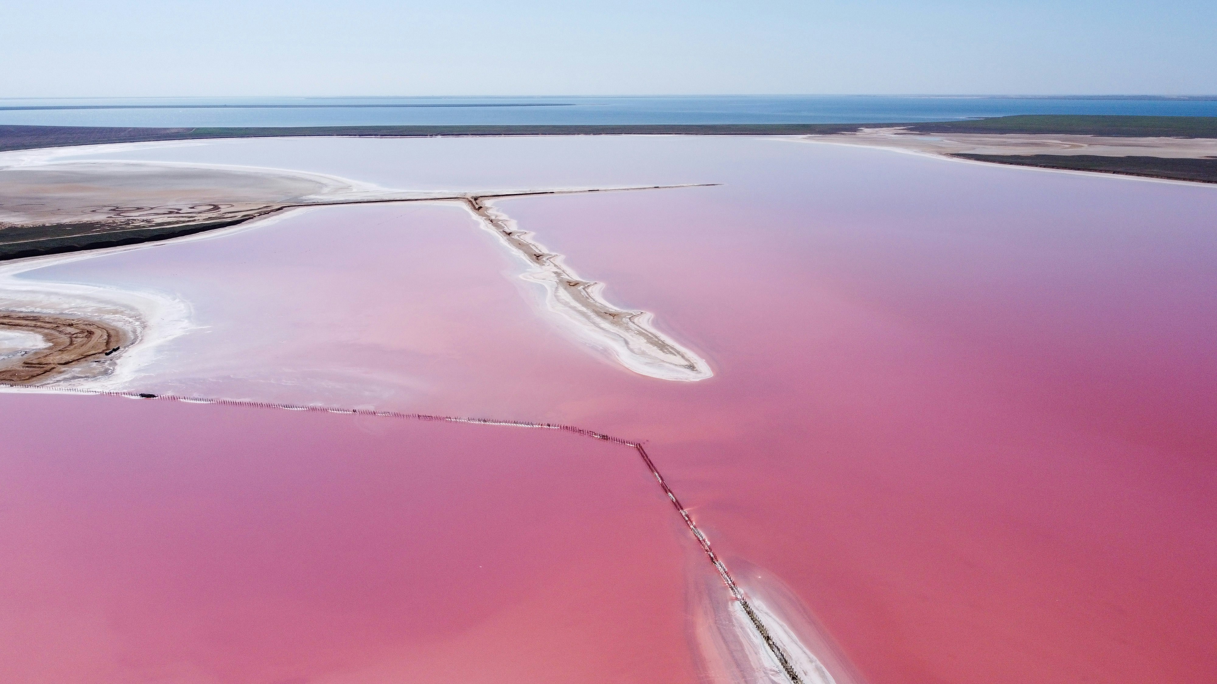 A large body of water with pink water photo – Free Генический район ...