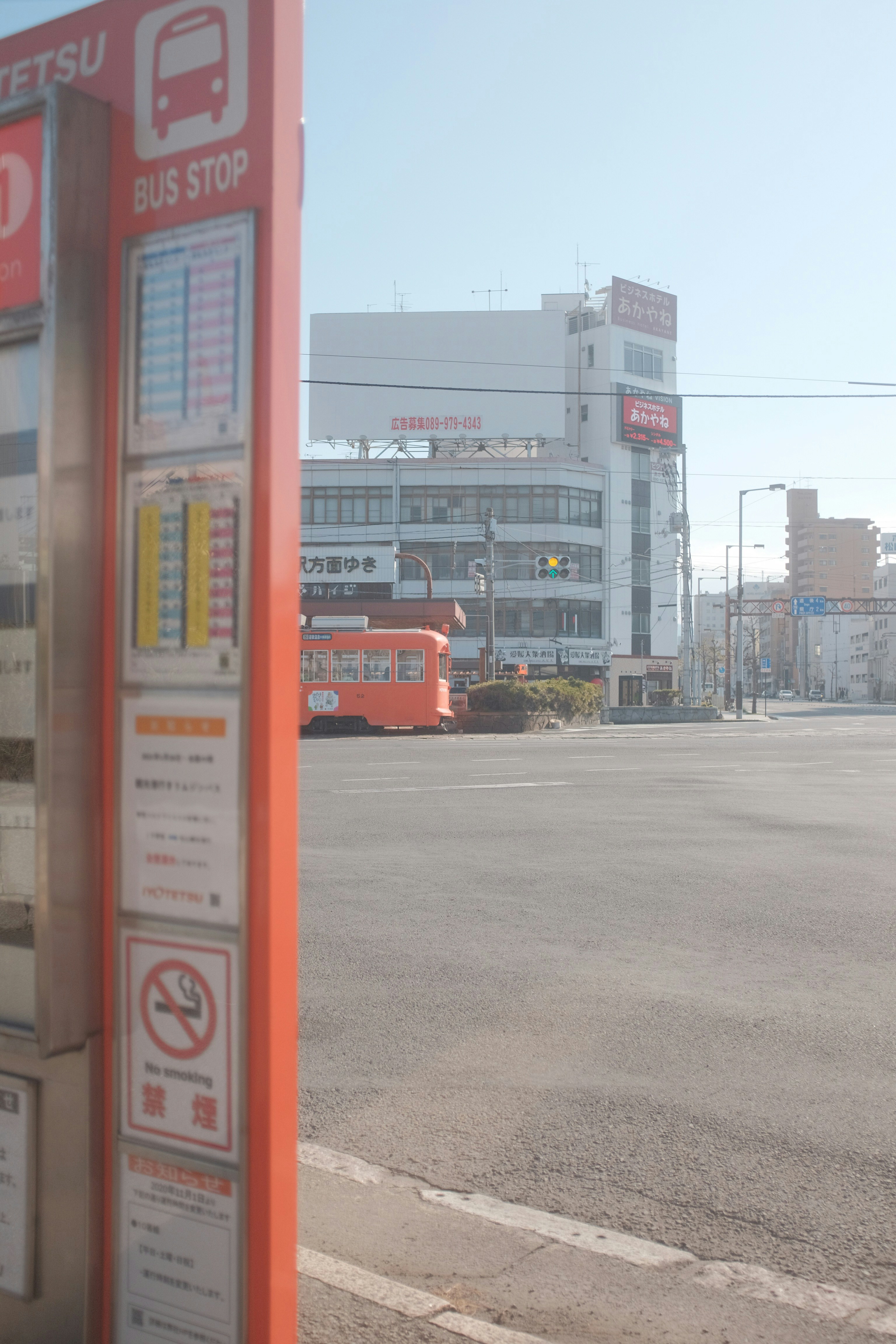 Red and white signage on gray concrete road photo – Free Grey Image on ...