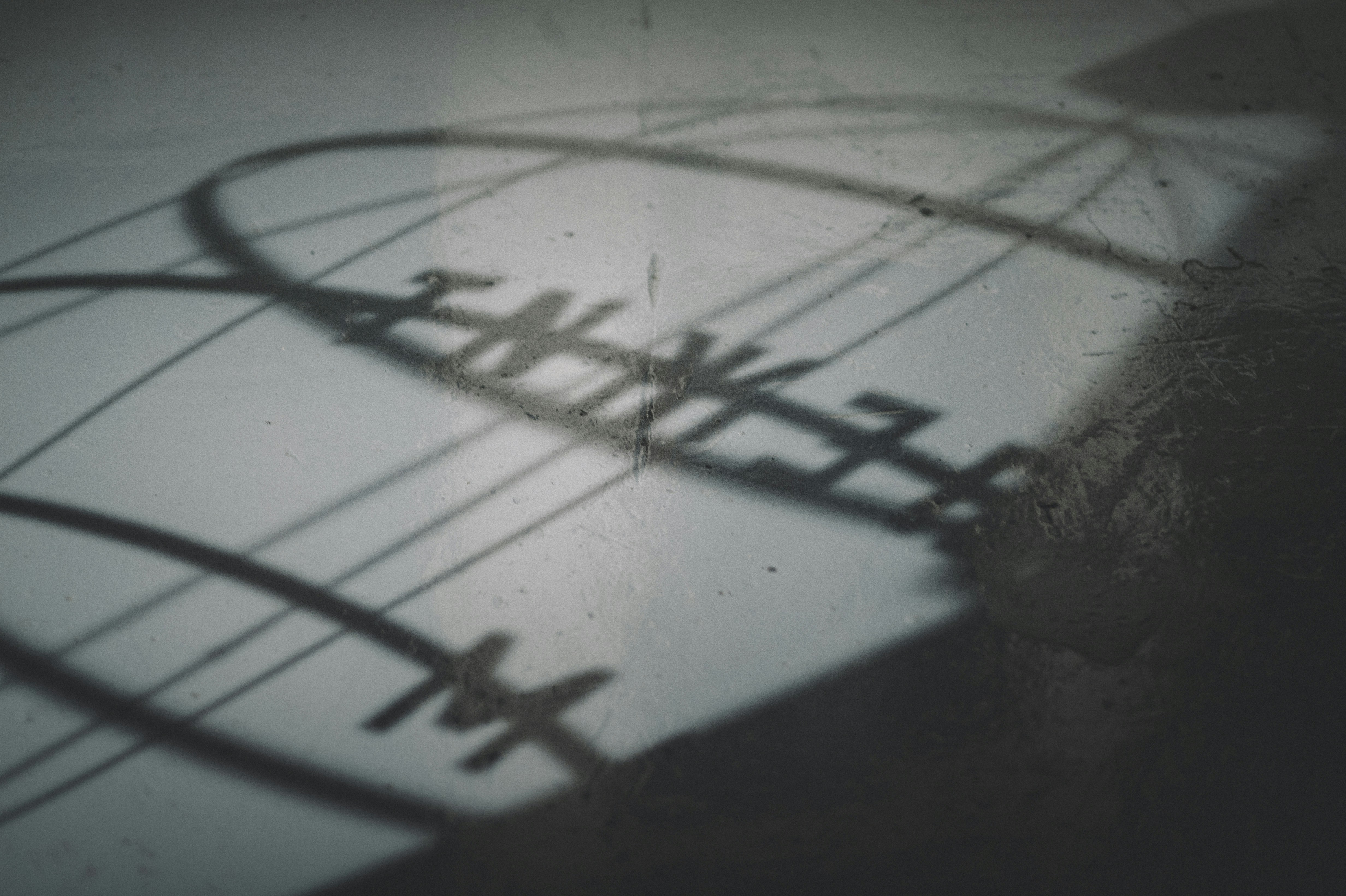 Shadowed Geometry: The Fretwork of Light on Concrete