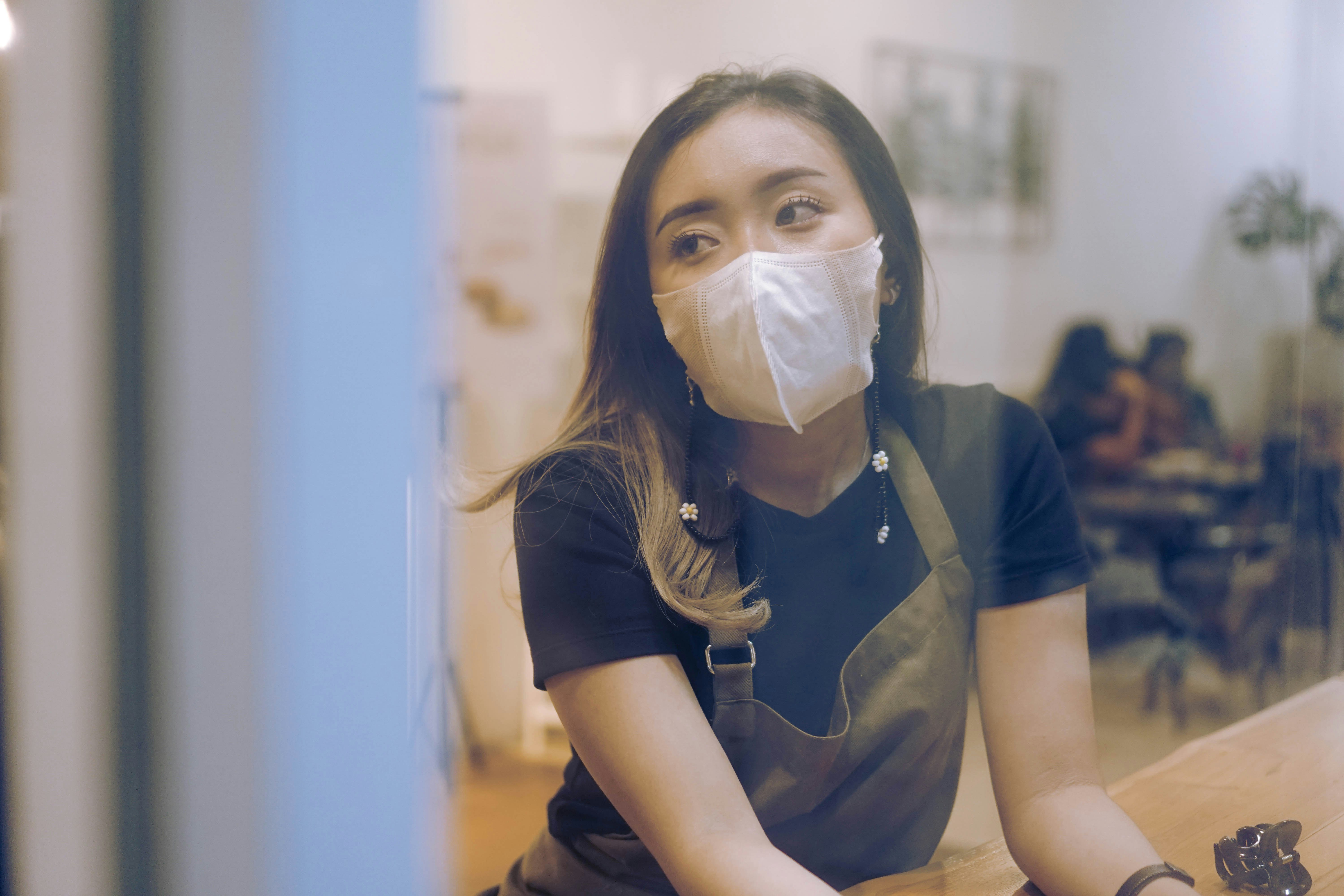 Masked Portrait through Café Glass: Soft Light and Focus