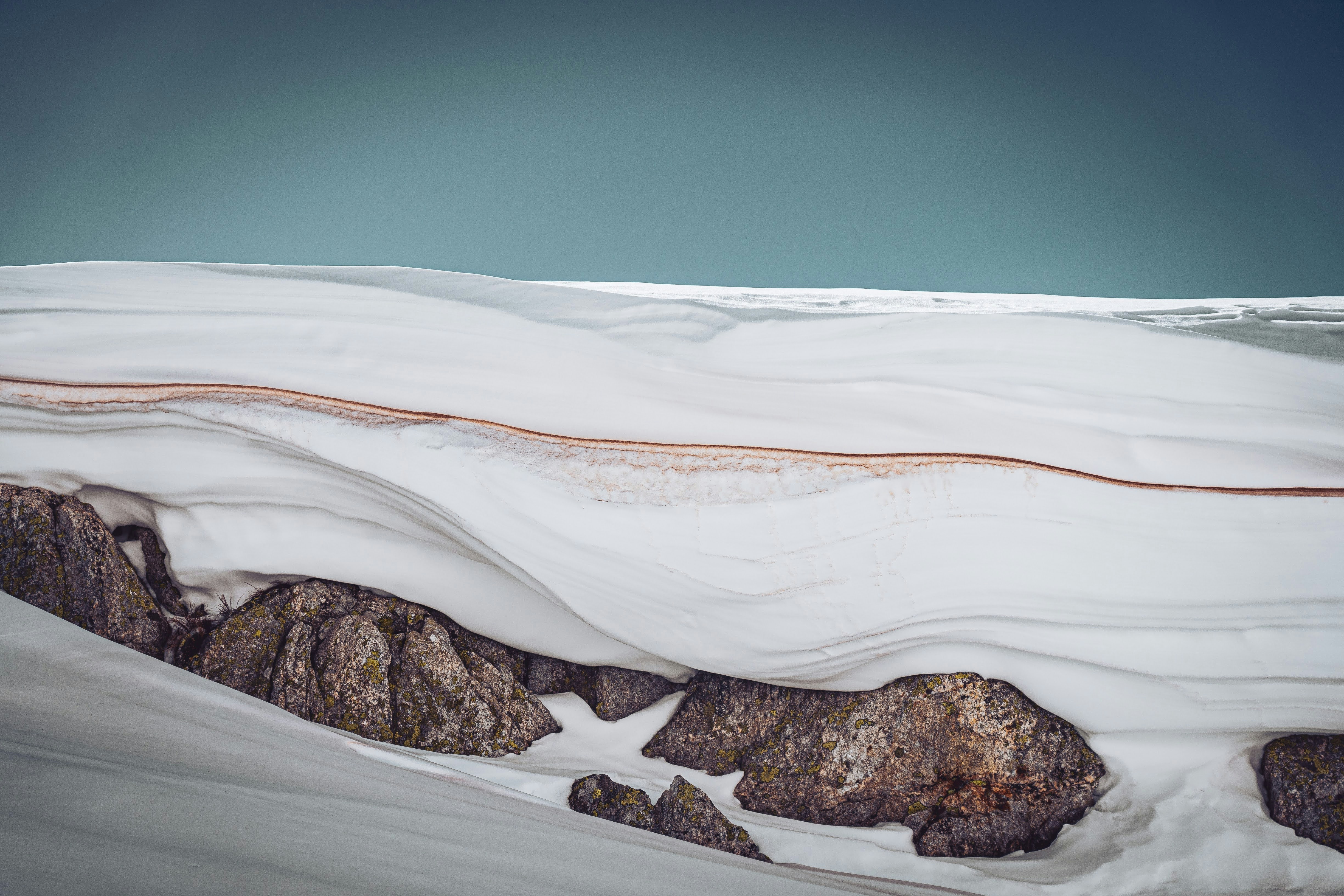 Rust Thread Across a Glacier's Quiet Ridge