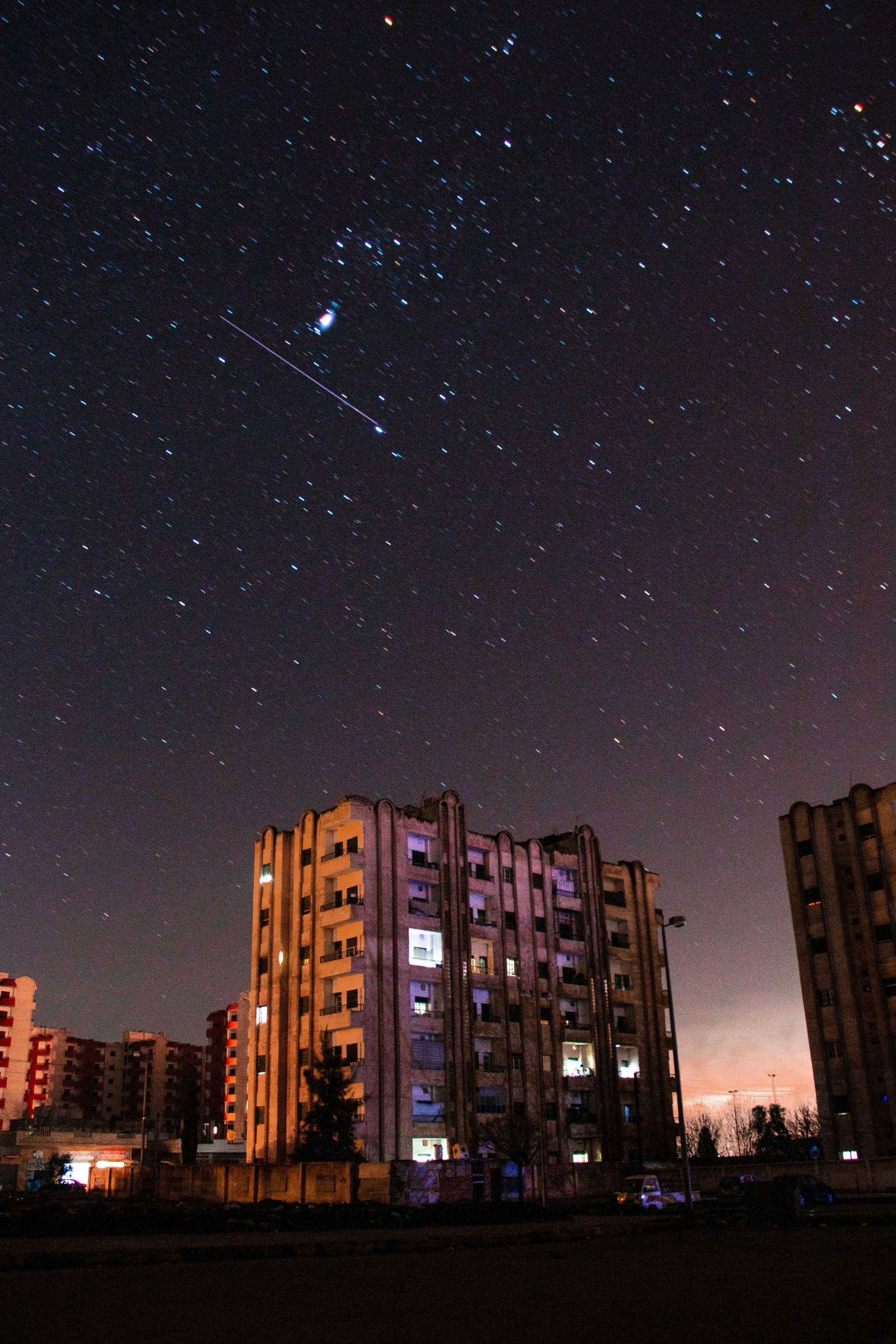 brown high rise building during night time