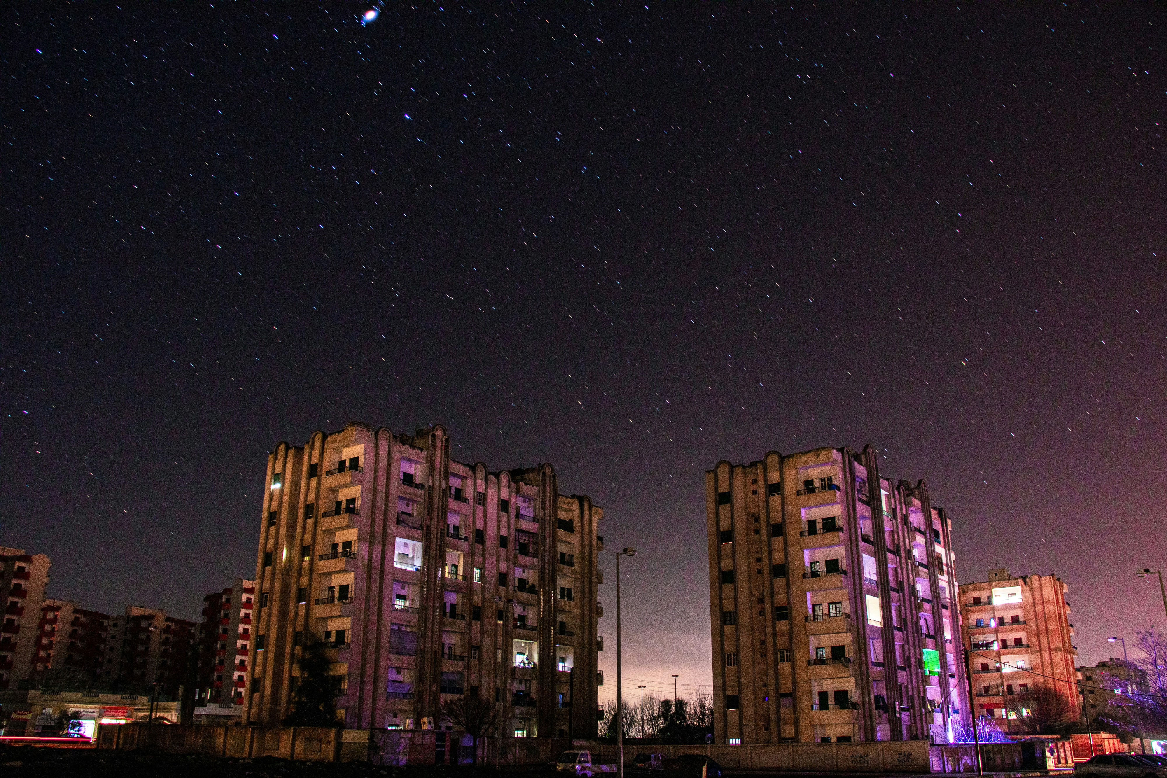 city lights turned on during night time