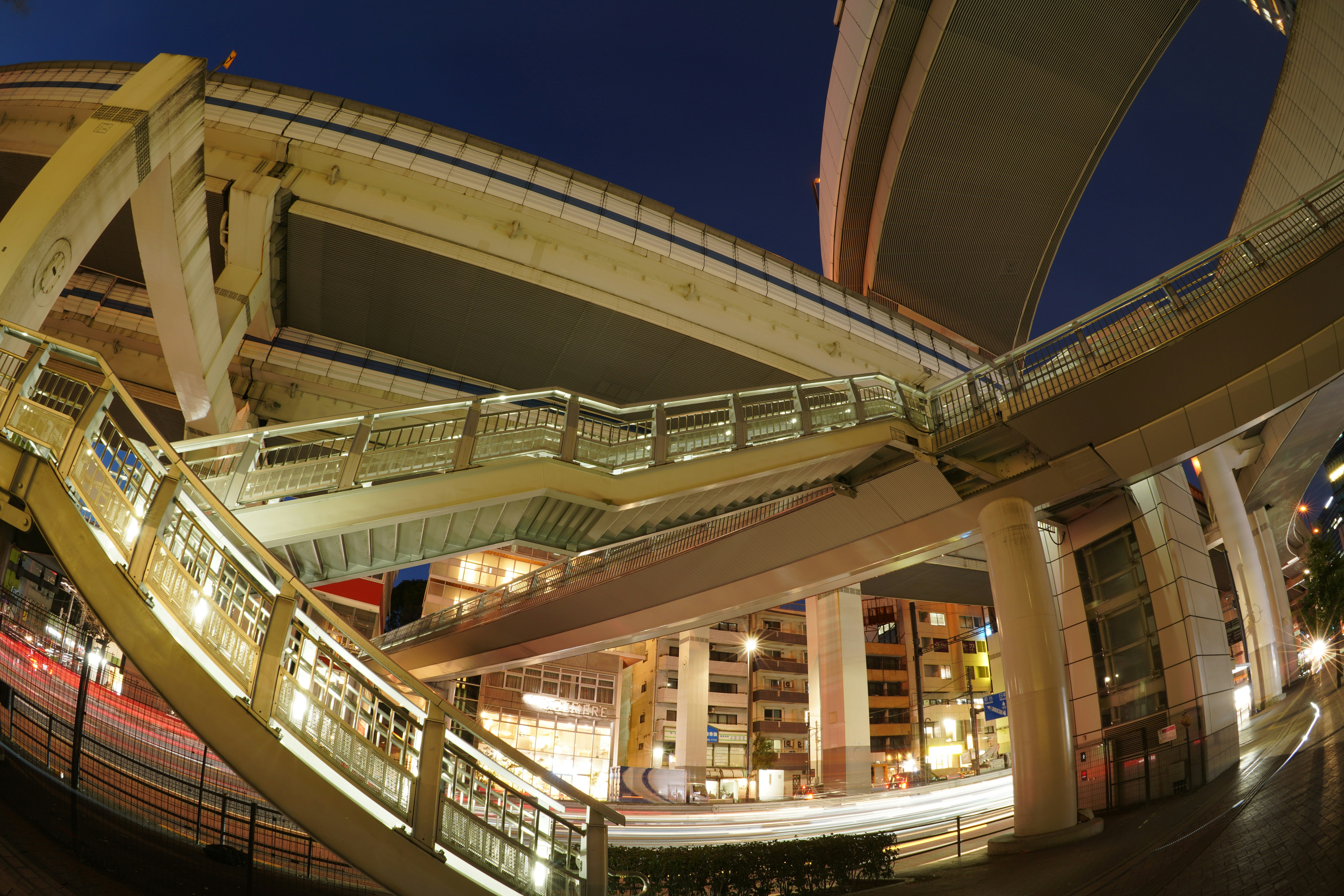 Neon Staircase Conundrum: A Nighttime Tangle of City Bridges