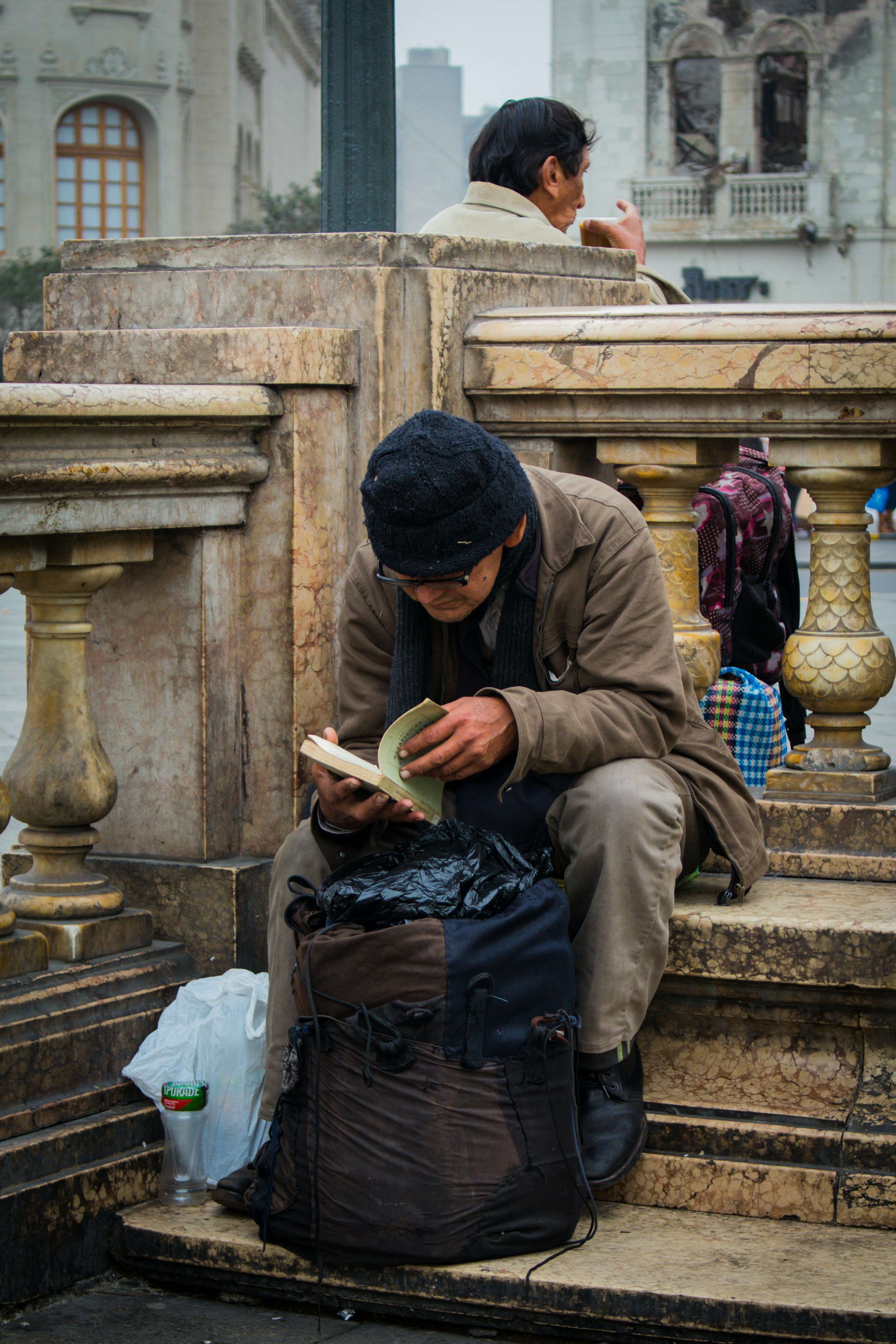 Marble Steps, Quiet Reading: A Solitary Moment in the City