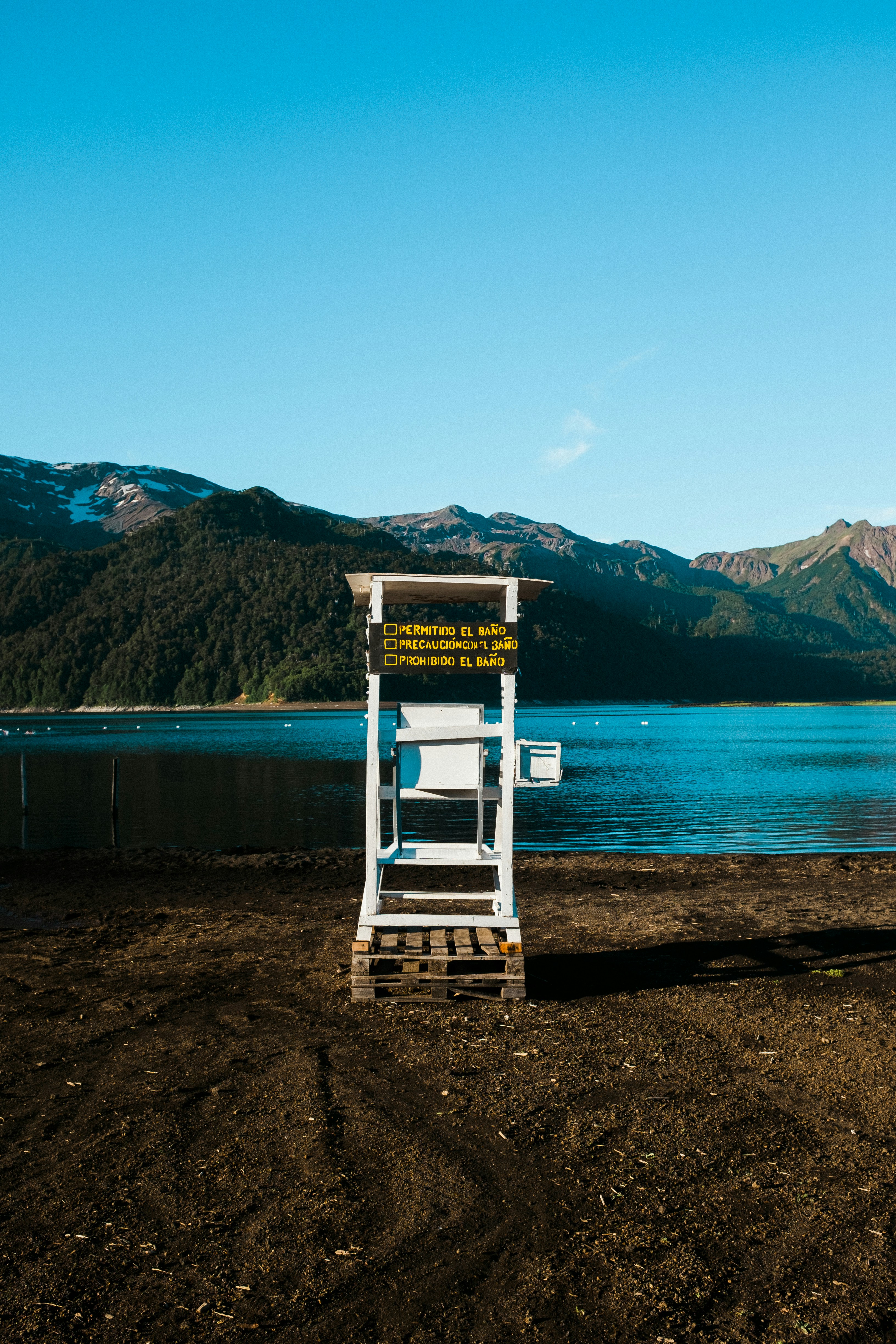 brown wooden dock on lake during daytime