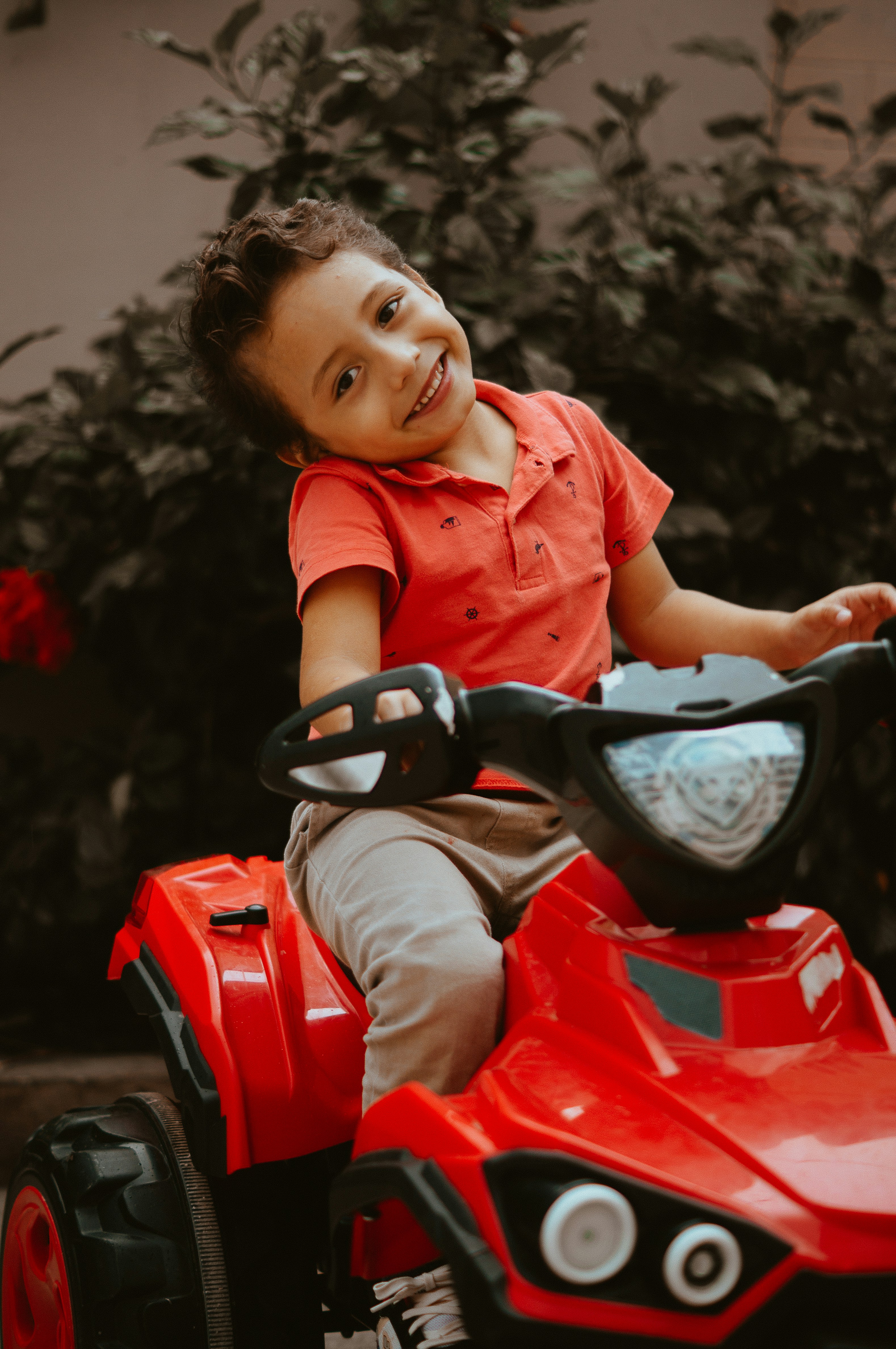 Girl in red dress riding red ride on toy car photo – Free México Image ...