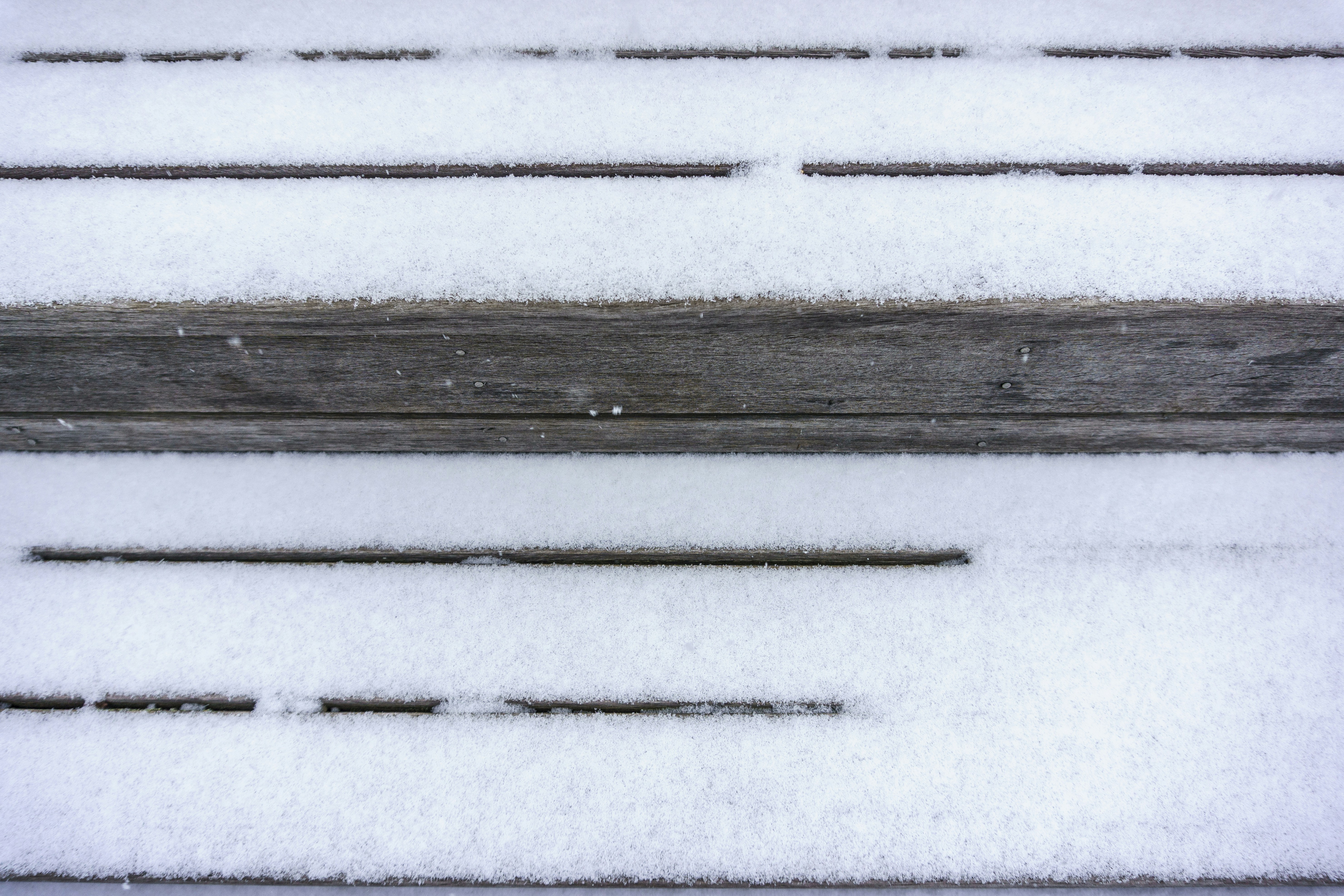 Snow-Wrapped Slats: A Minimalist Winter Deck