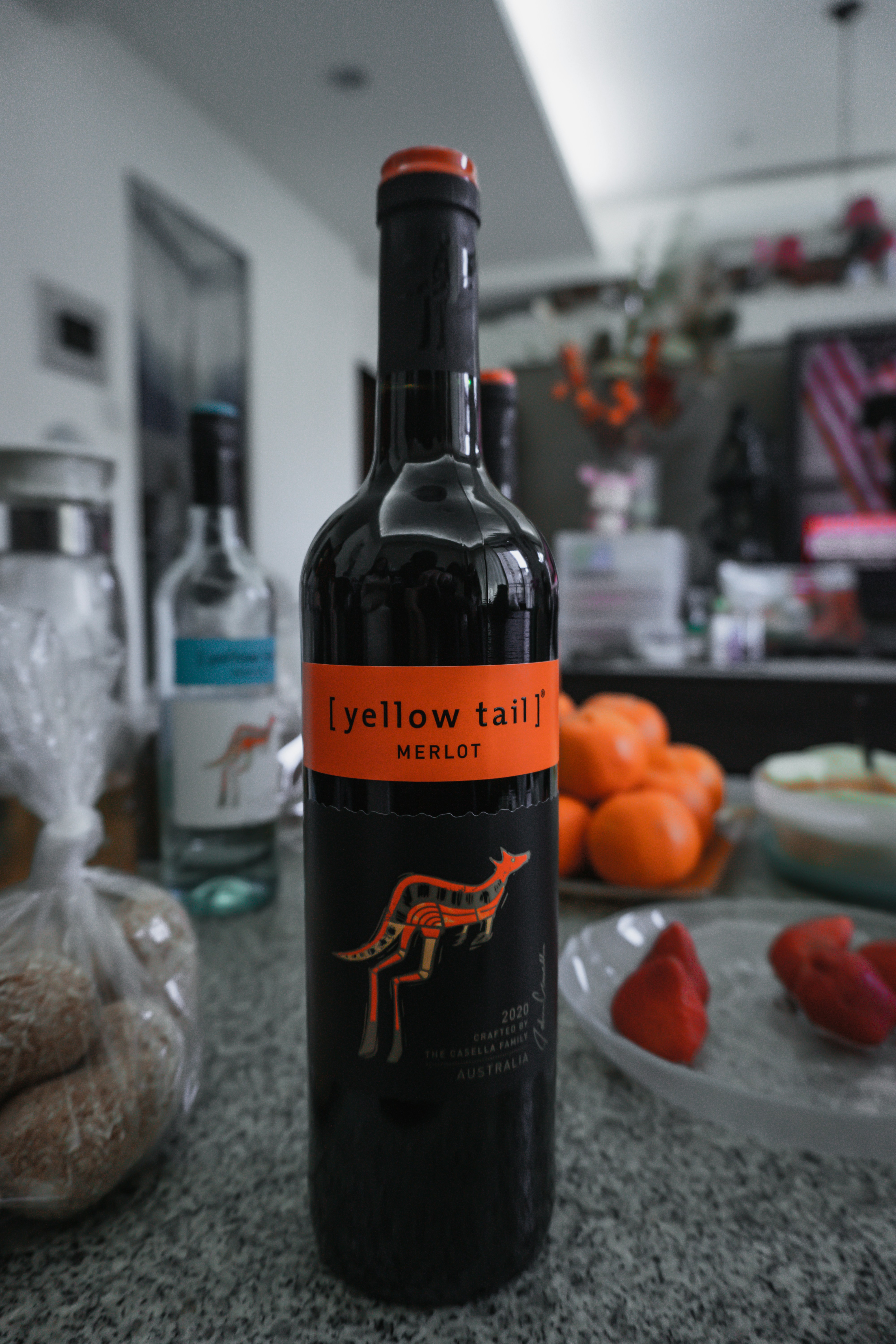 Yellow Tail Merlot Anchored on a Kitchen Counter: A Quiet Portrait of Everyday Taste
