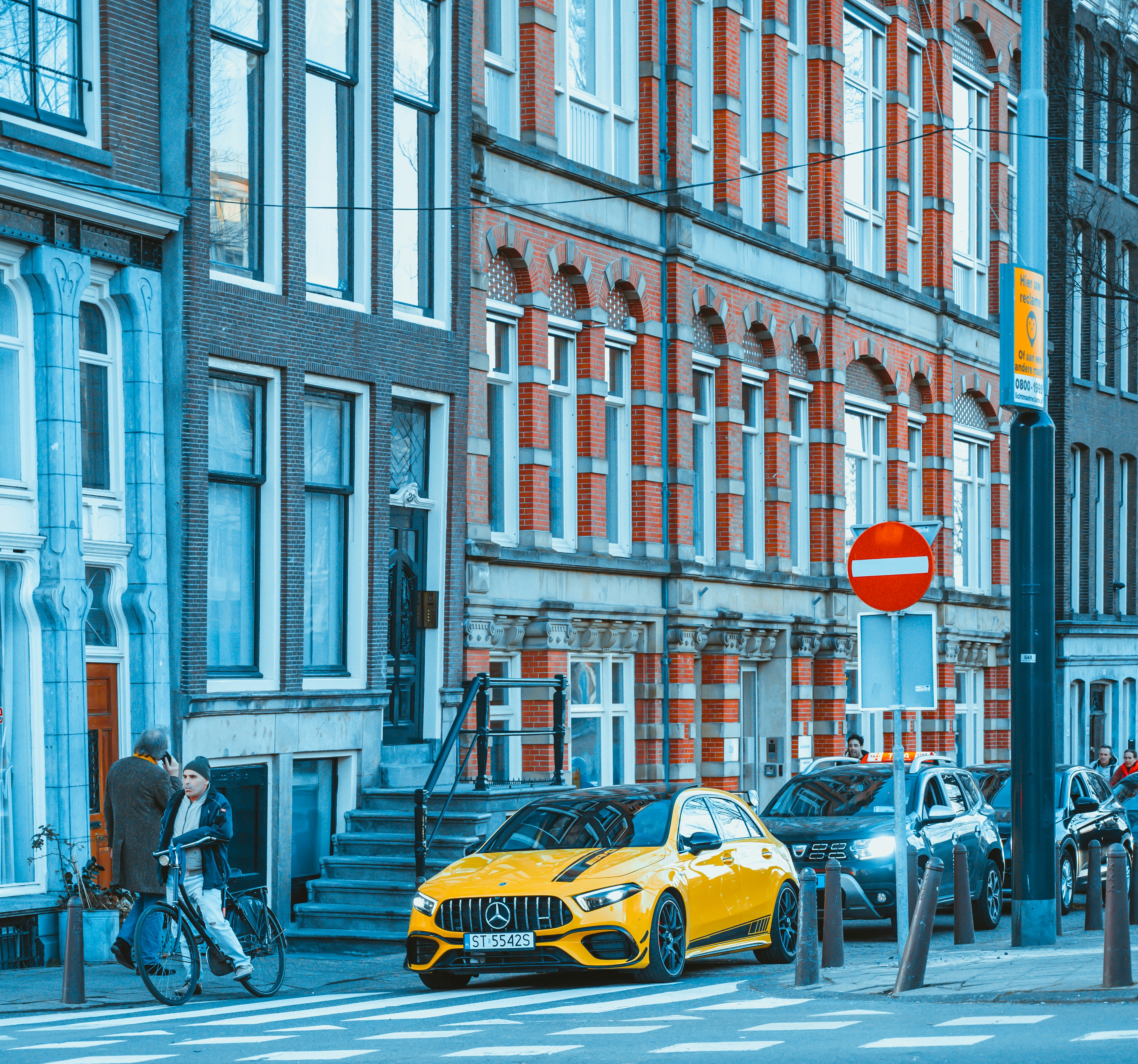yellow taxi cab on street during daytime