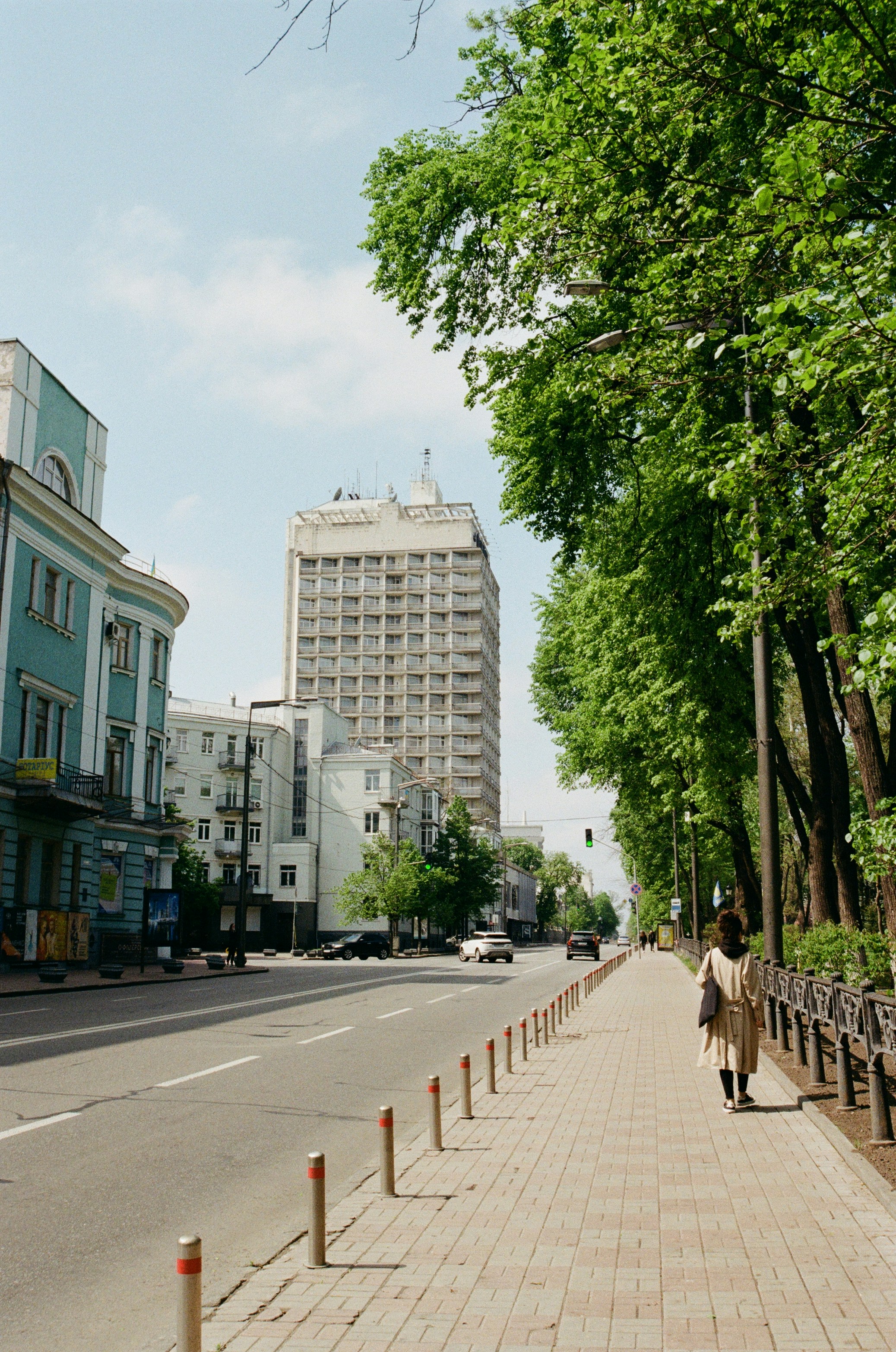 People walking on sidewalk near high rise buildings during daytime ...