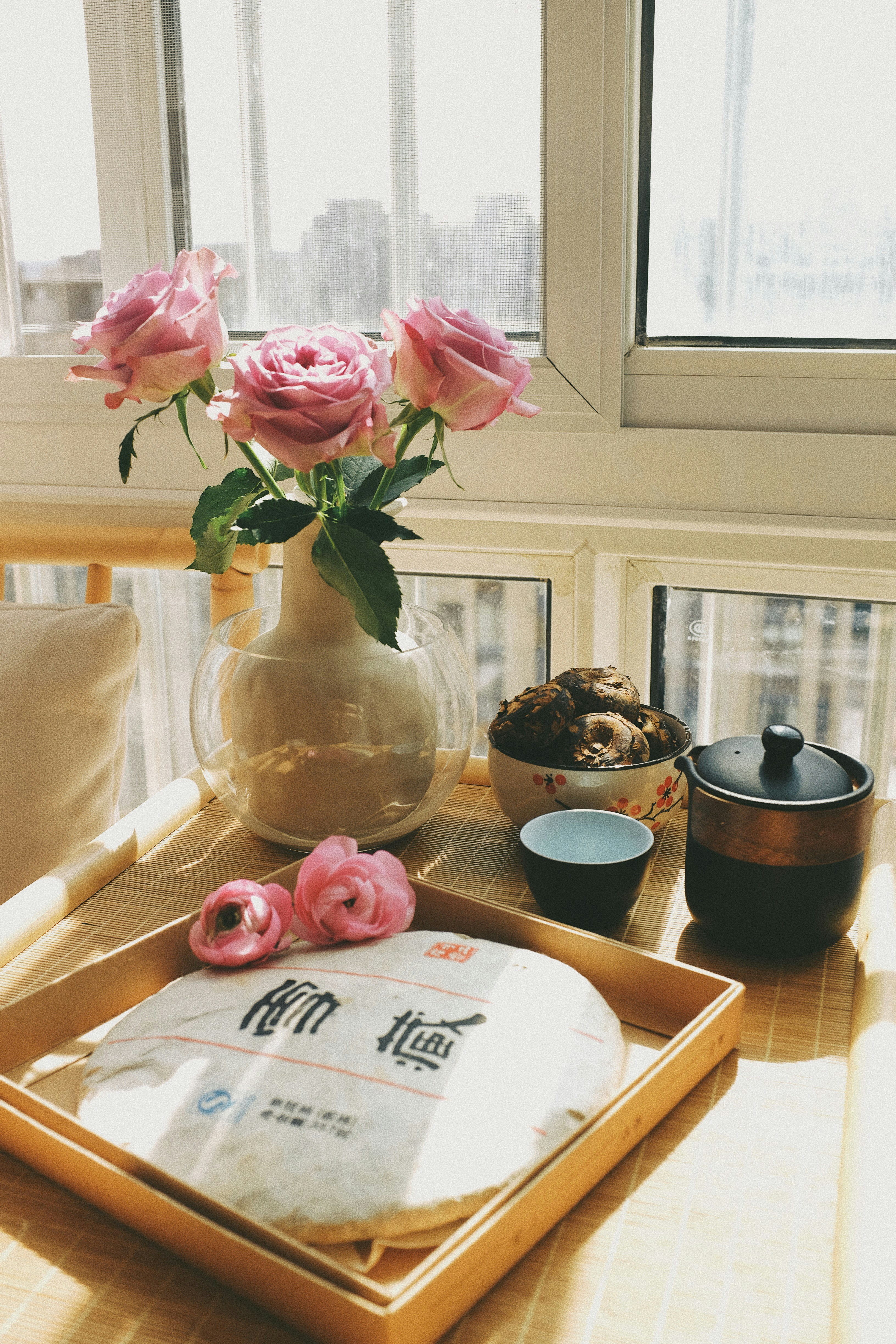 Sunlit Pink Roses Guard a Quiet Tea Tray by the Window