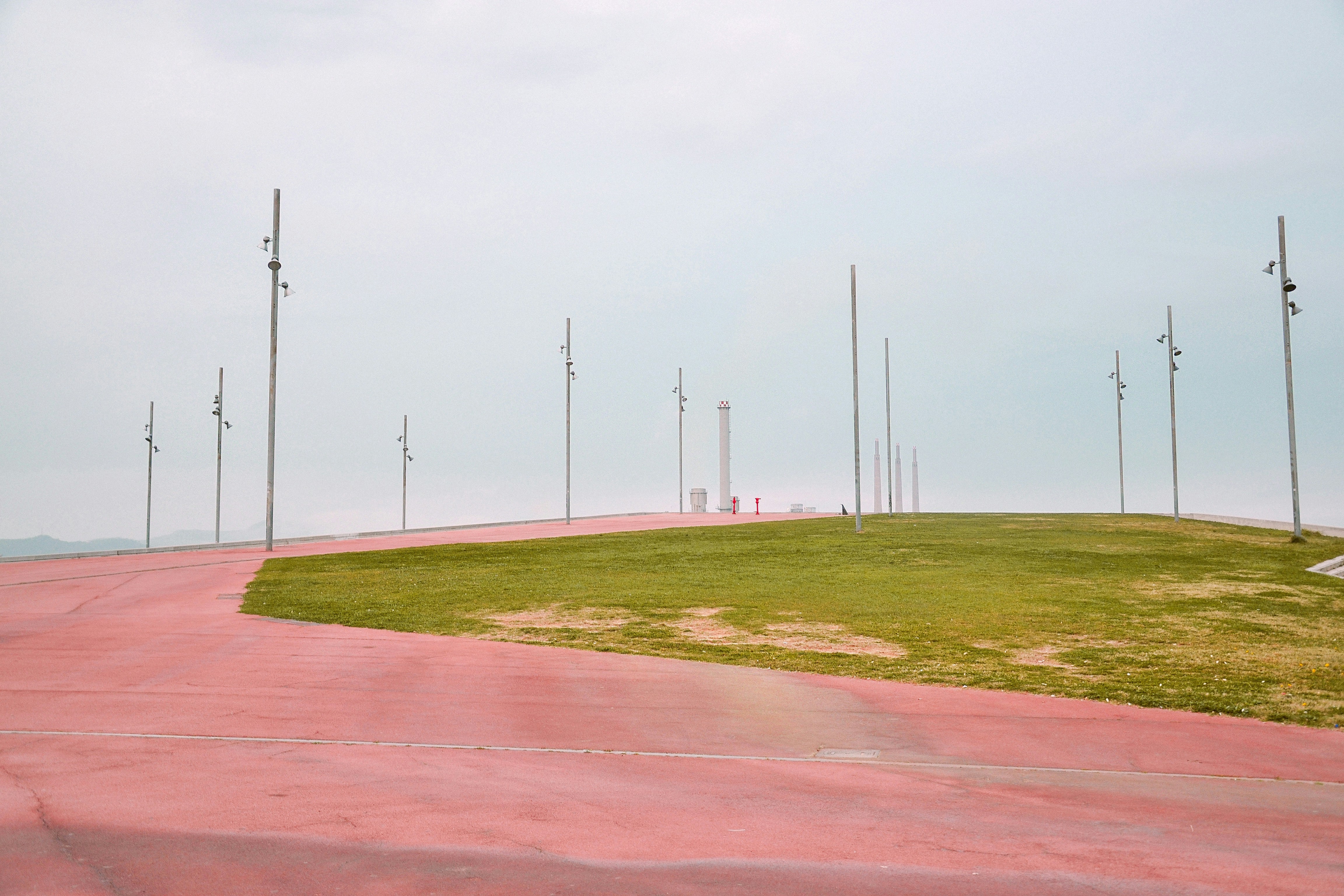 Red Promenade to the Distant Pier