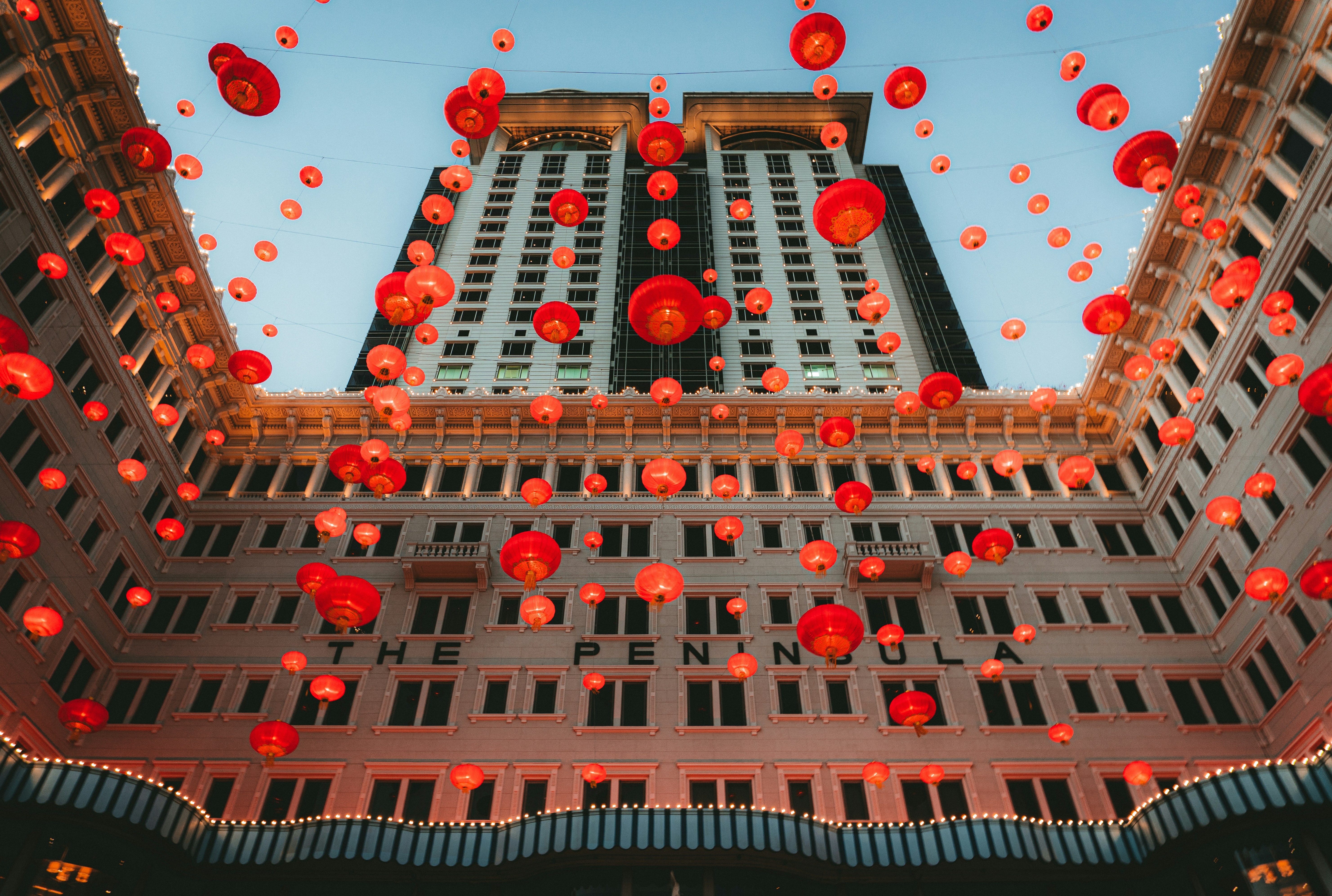Crimson Lantern Arc Framing The Penn Courtyard Tower