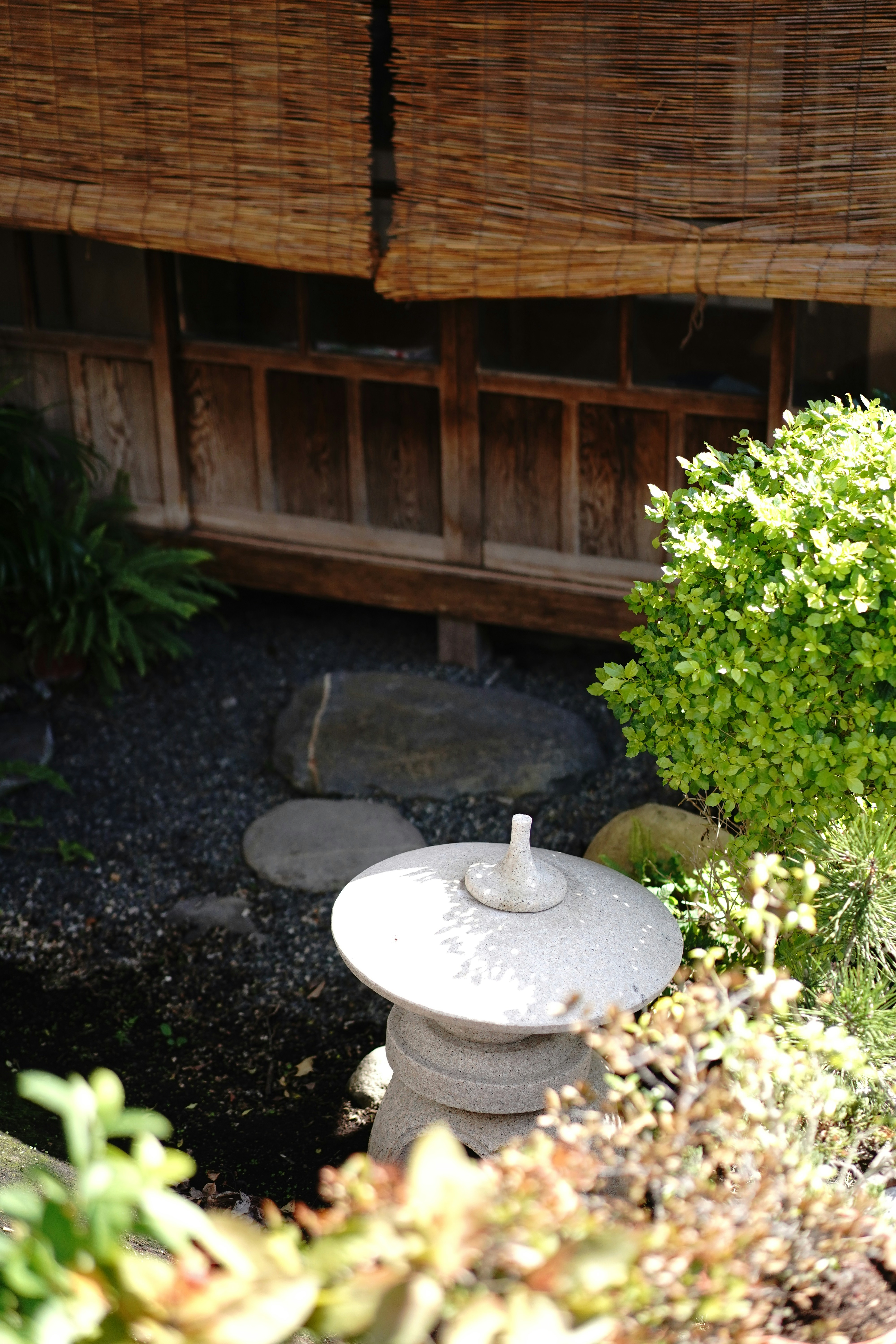Stone Lantern in a Quiet Japanese Garden, Framed by a Wooden Screen