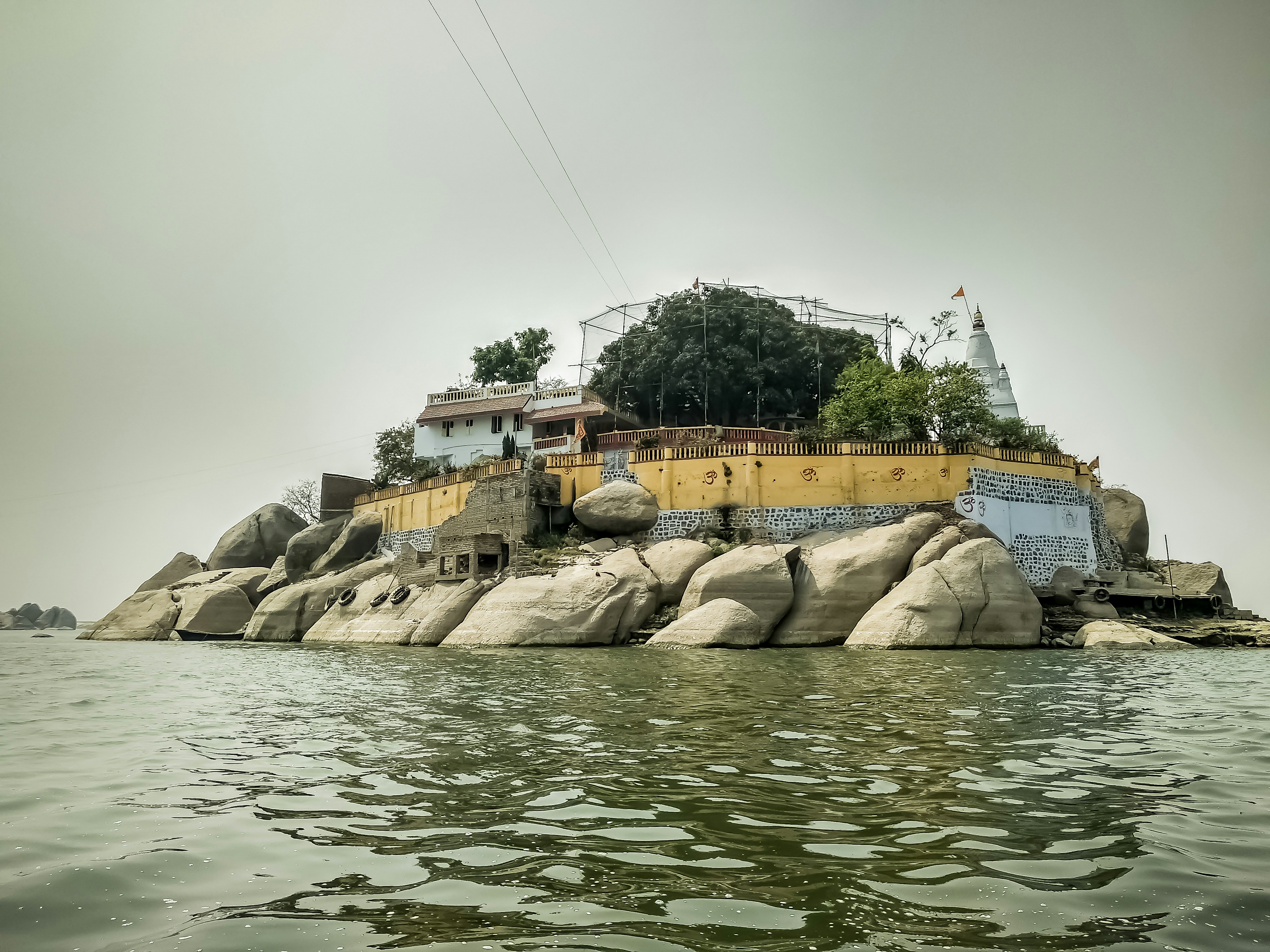 body of water near white concrete building during daytime