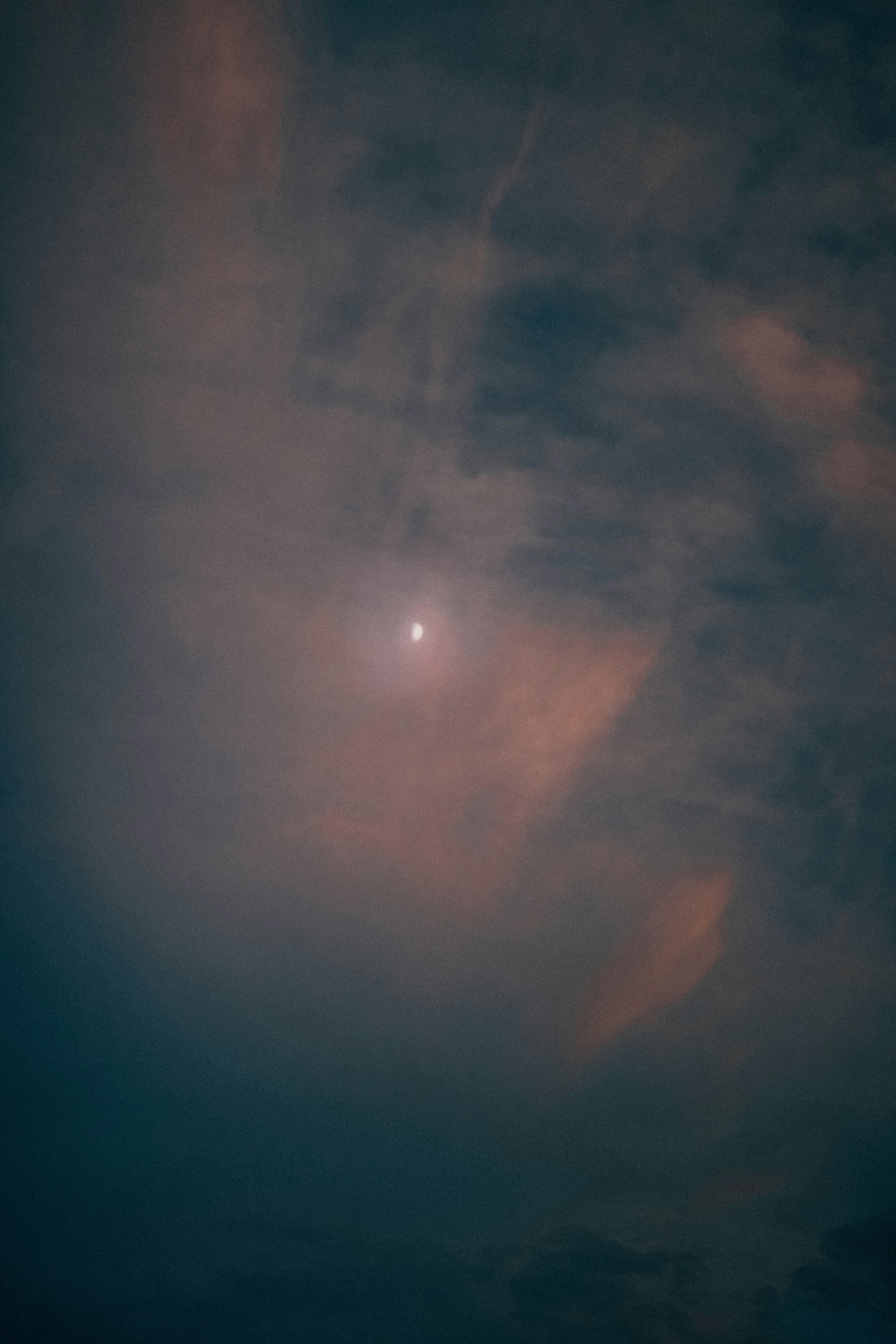 Whispers of the Moon Amidst Cloudy Veils