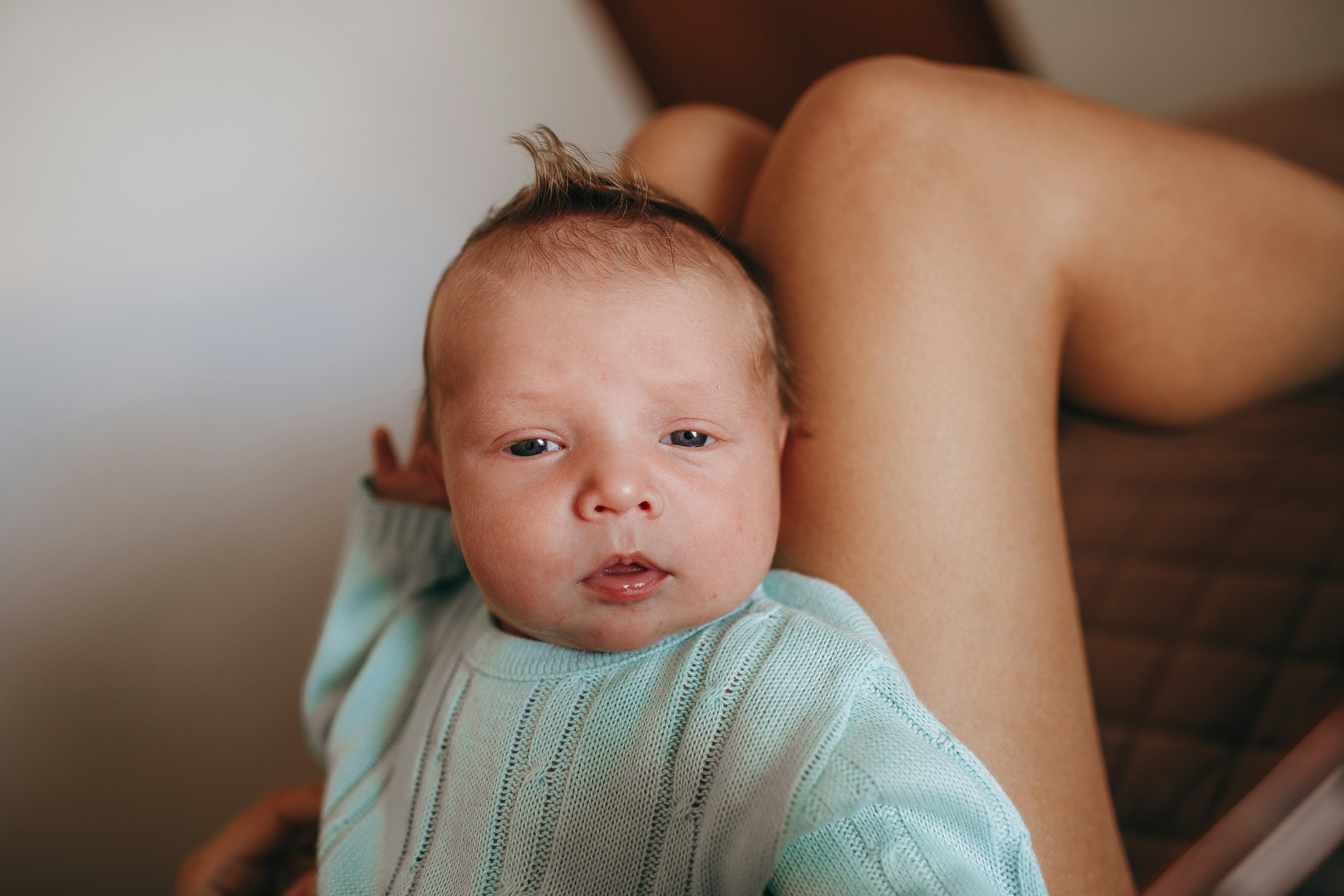 Woman carrying baby in blue and white stripe onesie photo – Free ...