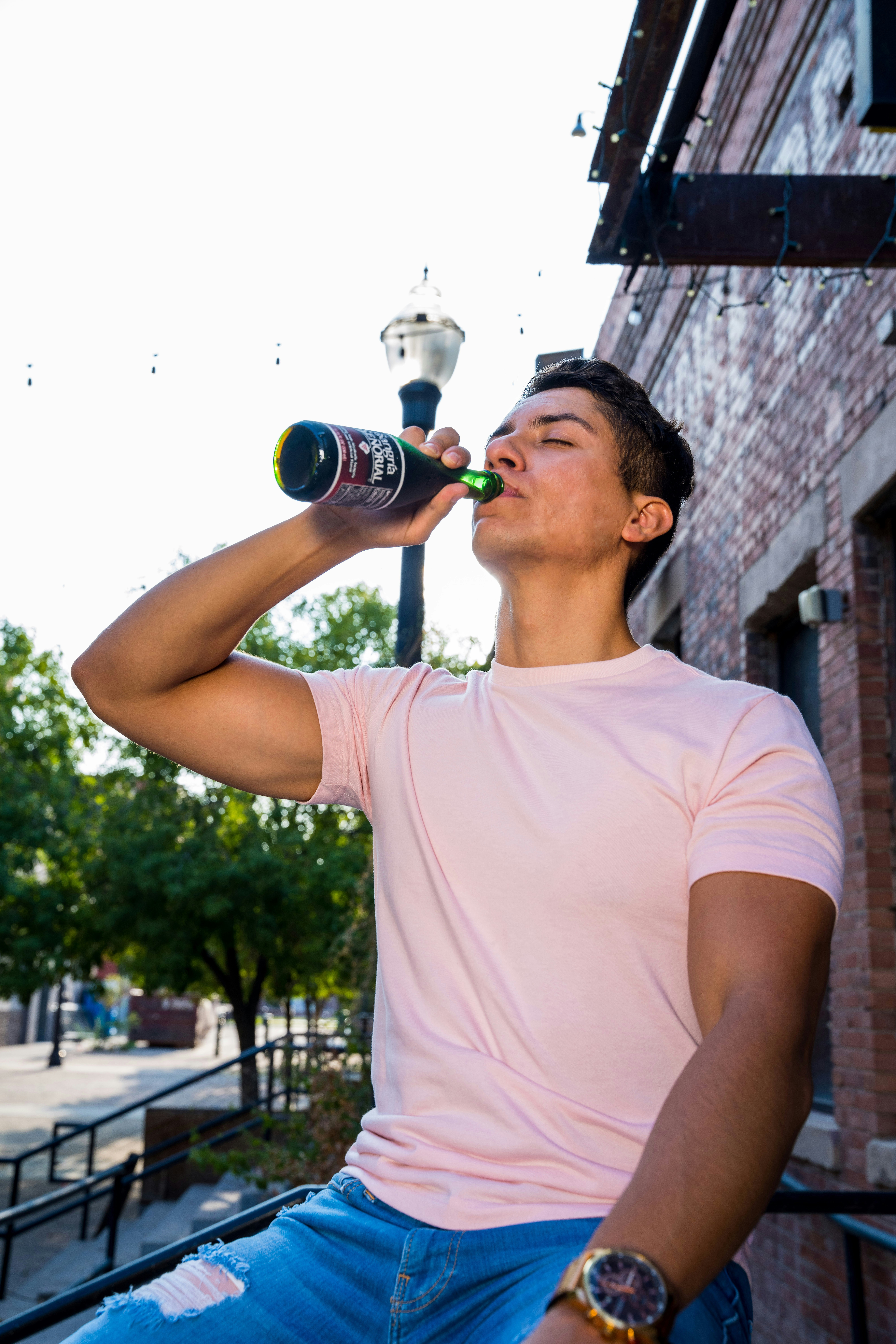 Man in white crew neck t-shirt drinking sprite soda photo – Free Soda ...