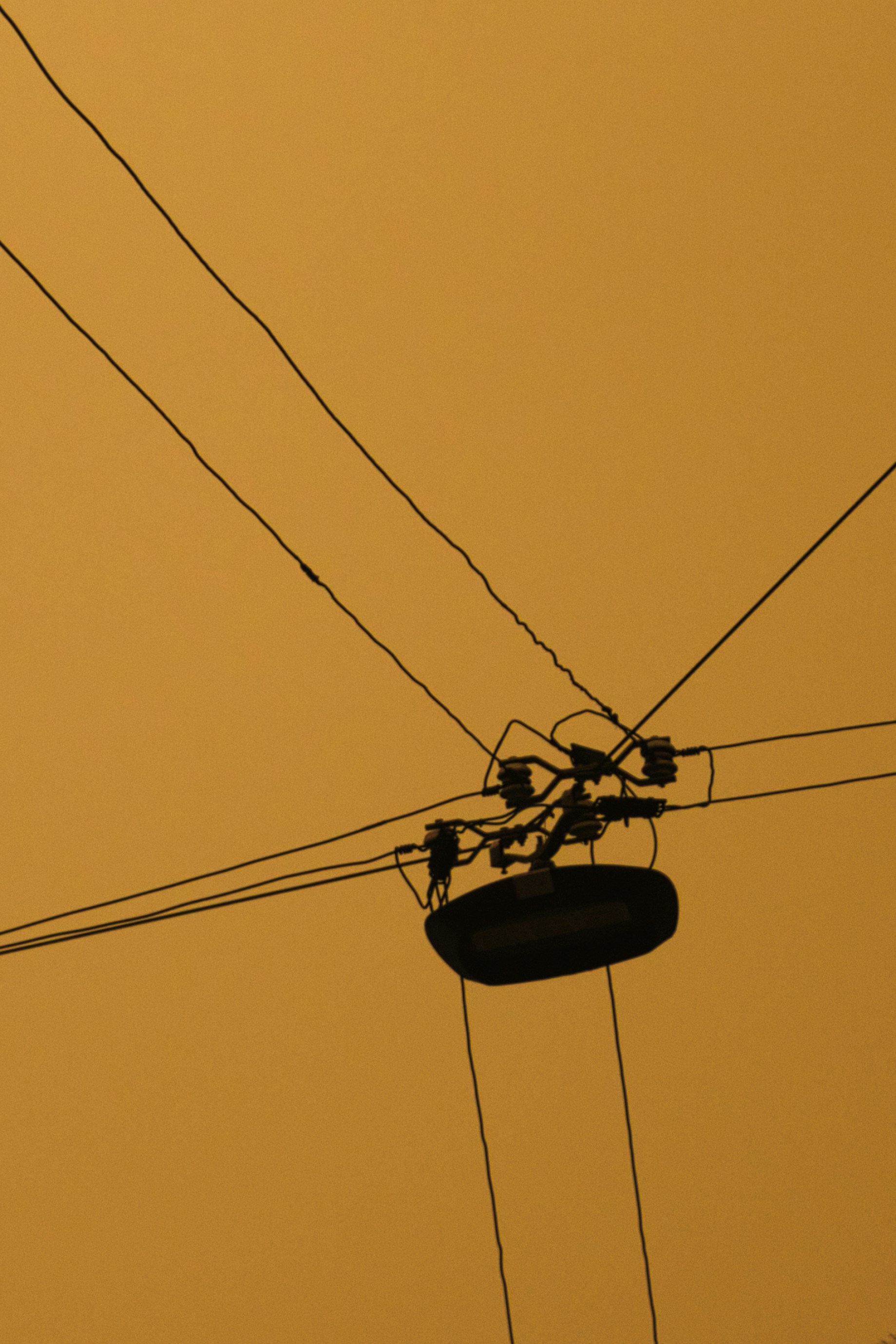 Tangent Convergence: Wires, Light, and a Tangerine Dusk