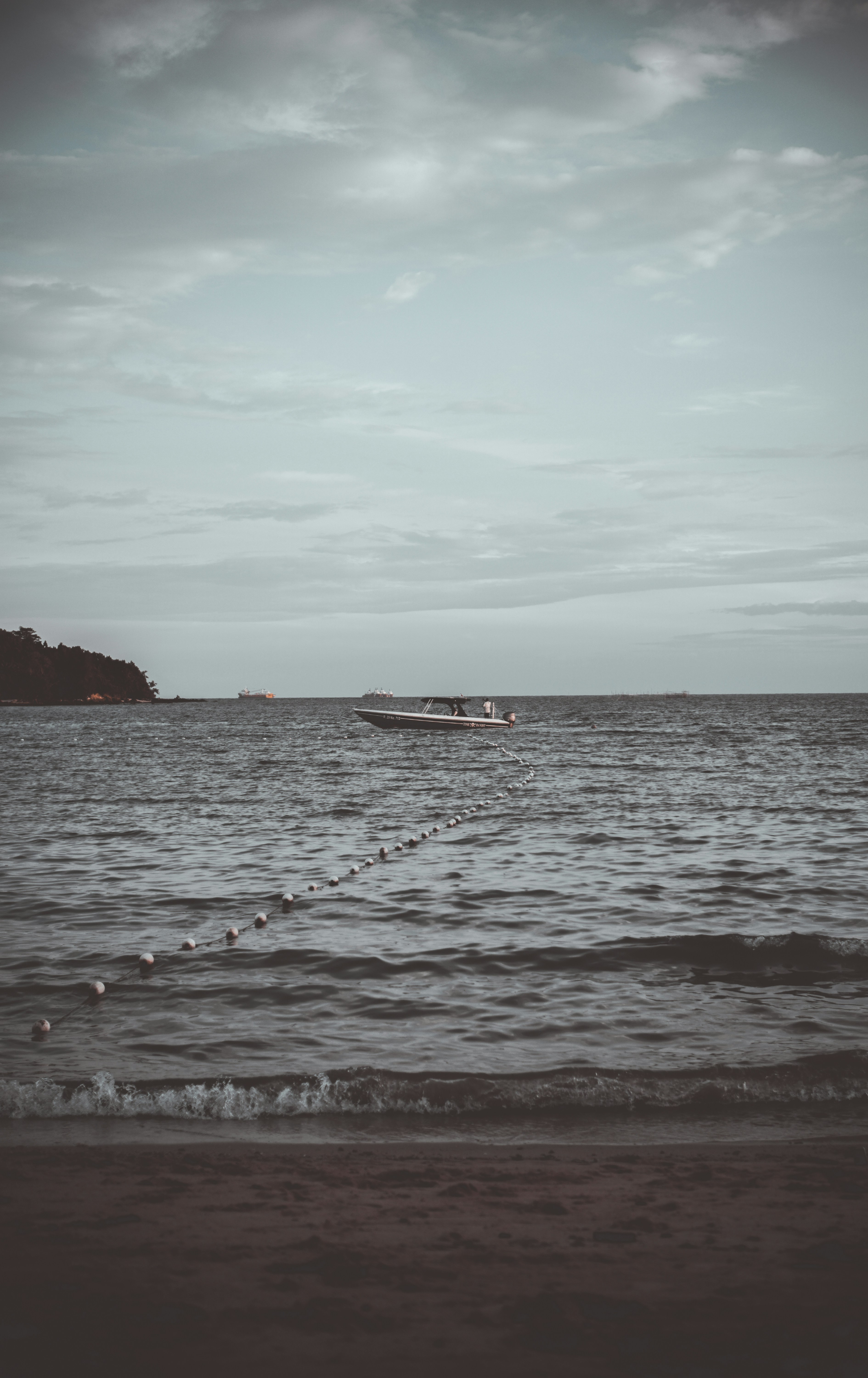 Horizon Bound: A Lone Boat Tracing a Quiet Path Across the Sea