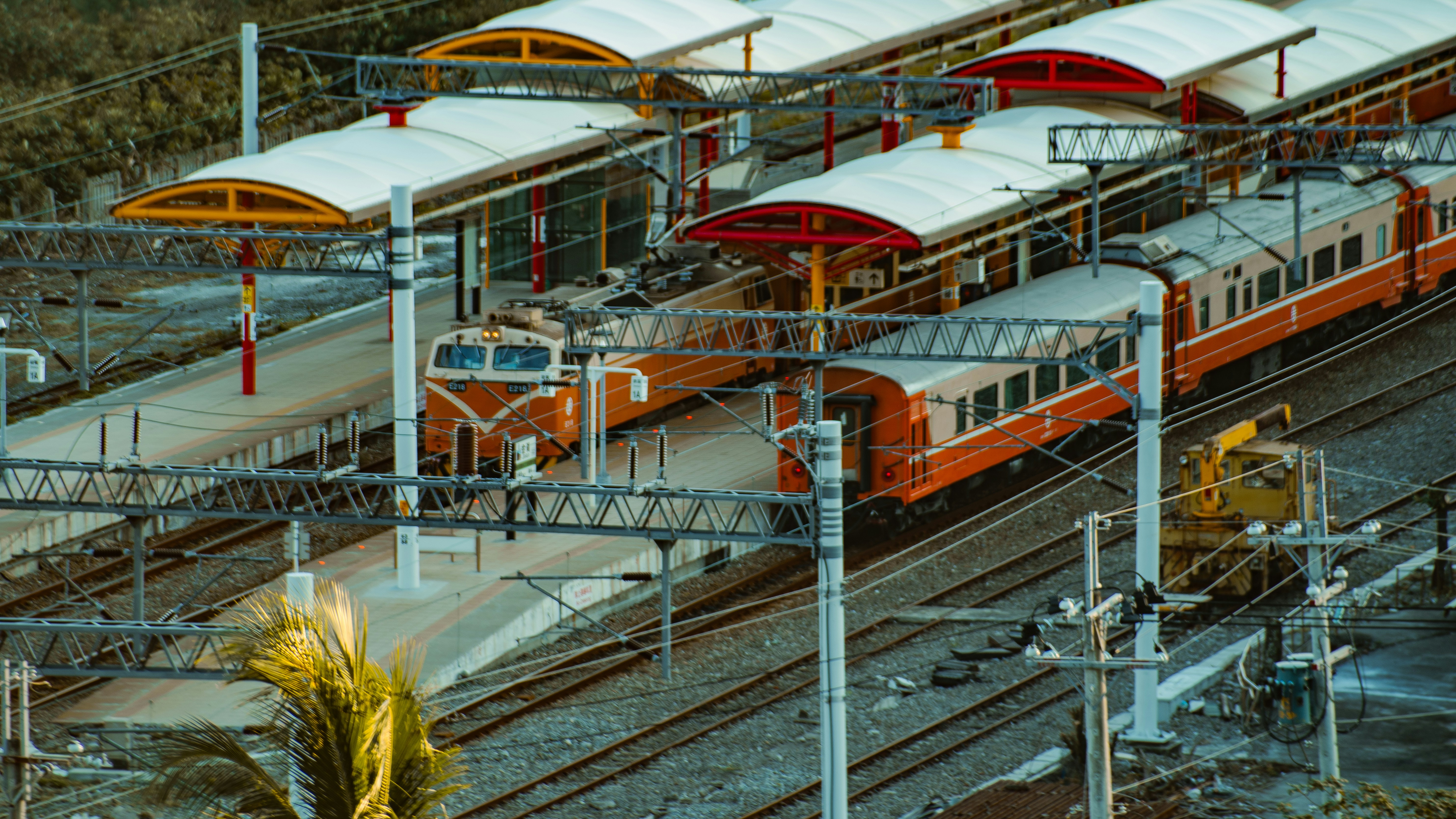 White and red train on rail tracks during daytime photo – Free Taichung ...