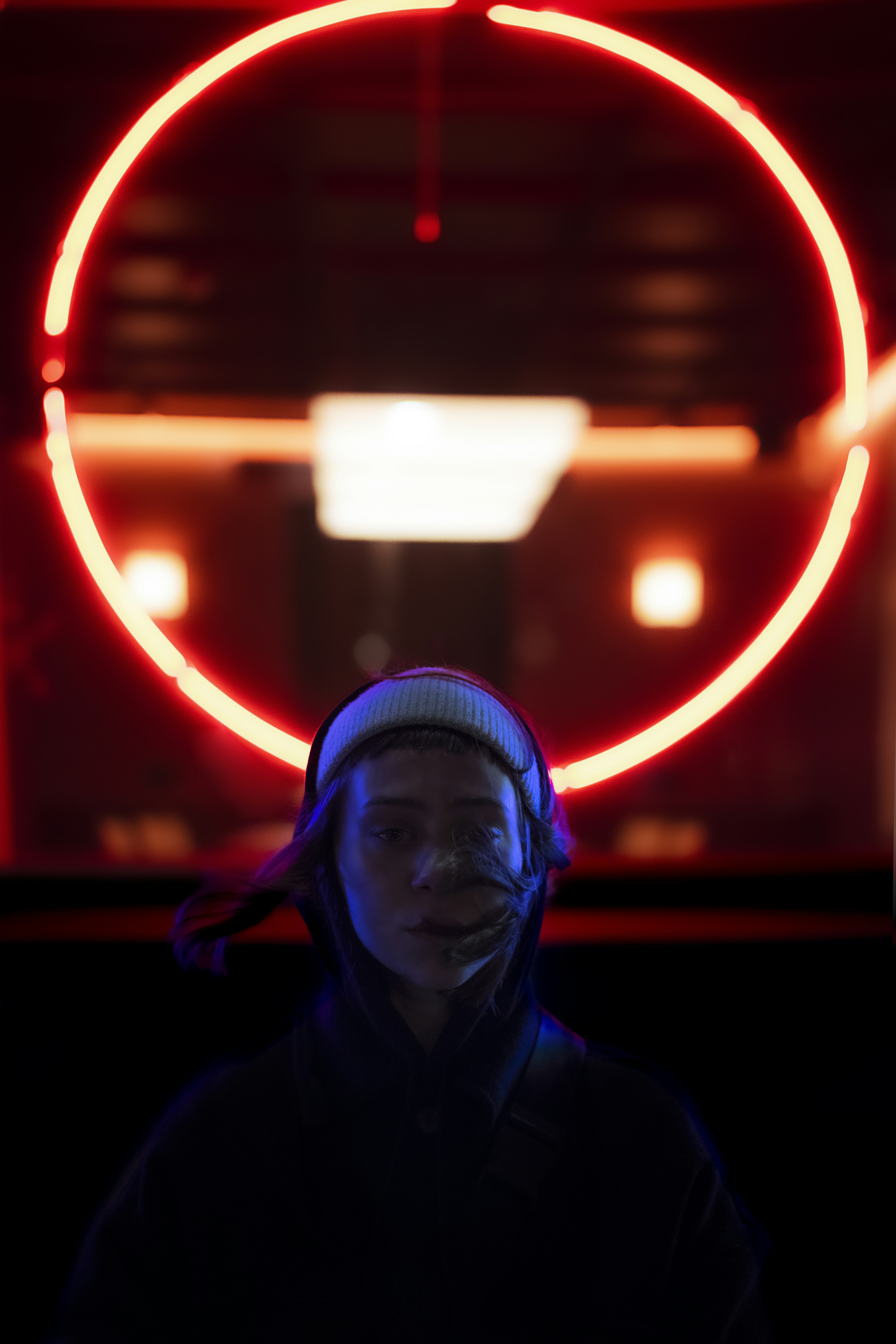 Neon Halo: A Quiet Moment Beneath the Red Circle