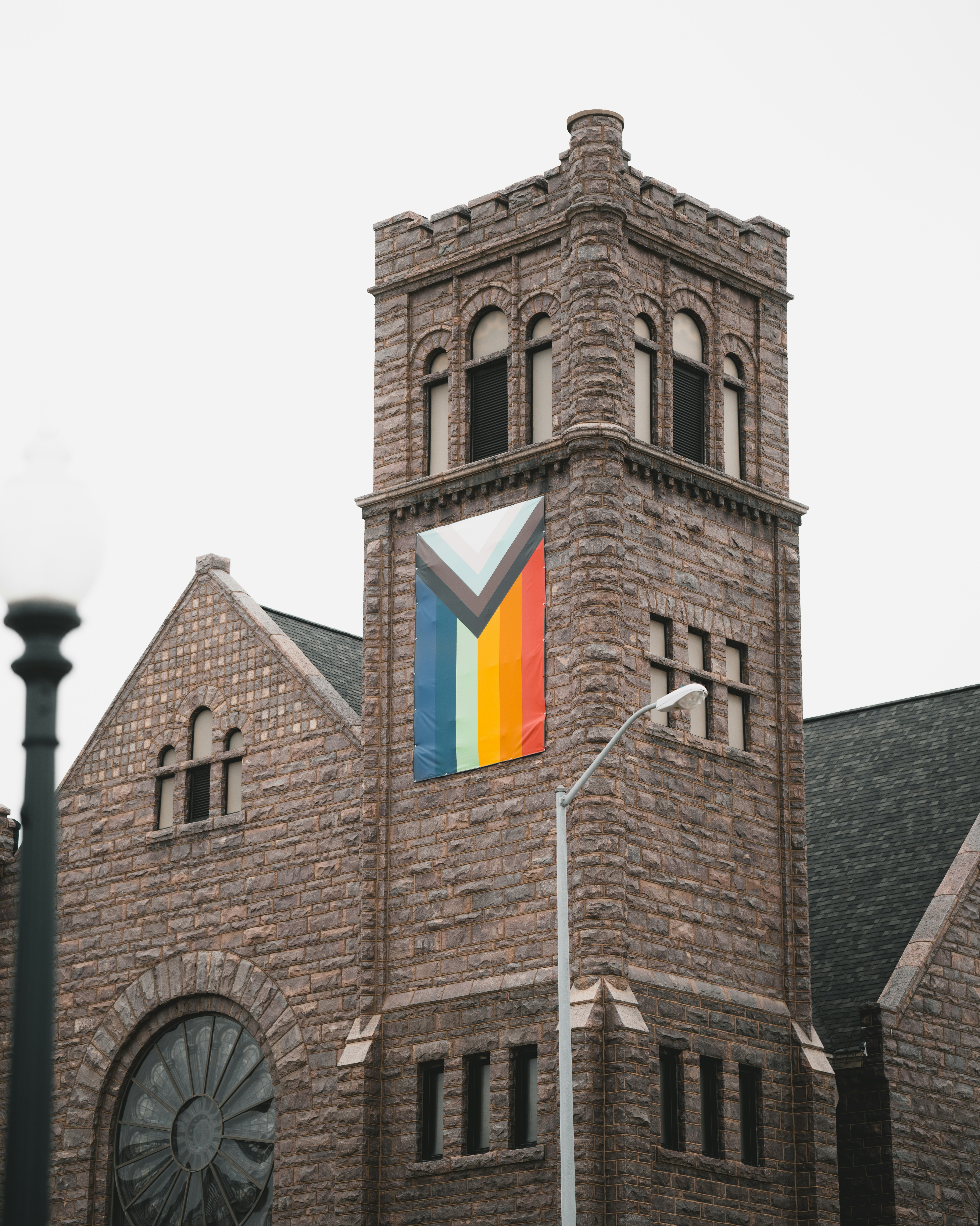 Brown brick building with yellow and red windows photo – Free Sioux ...