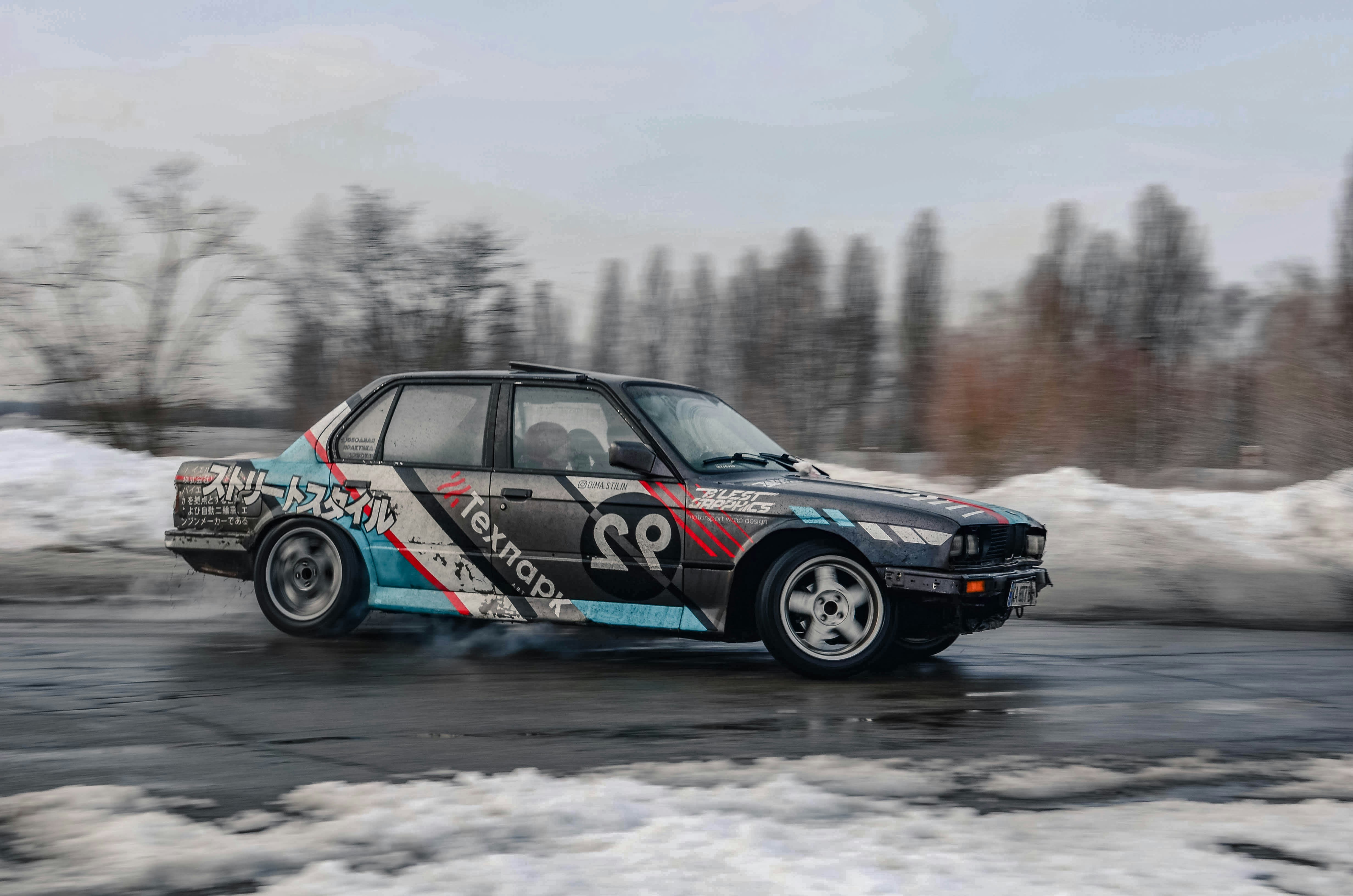Blue and red bmw m 3 on snow covered road during daytime photo – Free ...