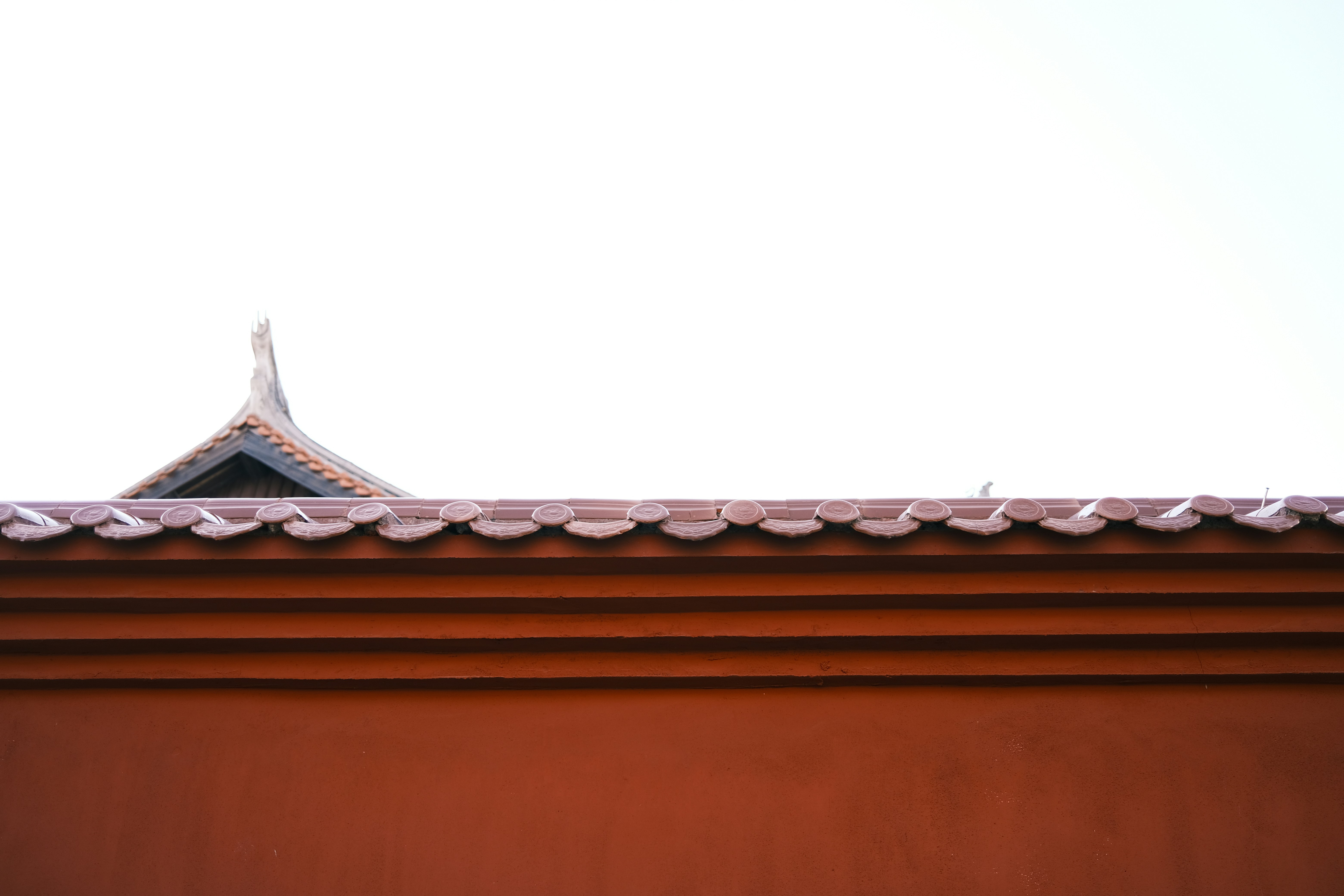 brown wooden roof under white sky during daytime
