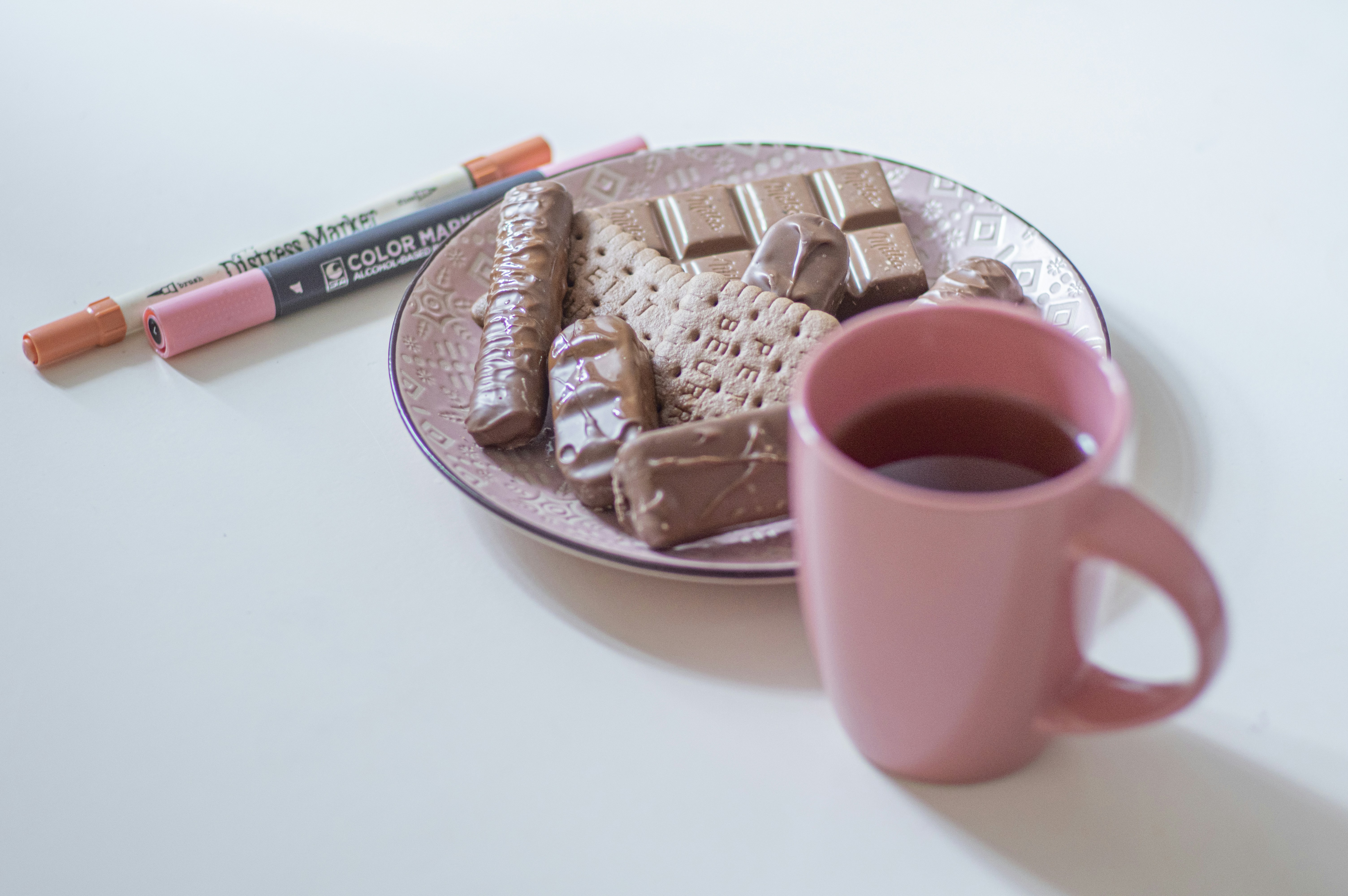 Pastel Plate: Chocolates, Wafer Rolls, and a Blush Cup