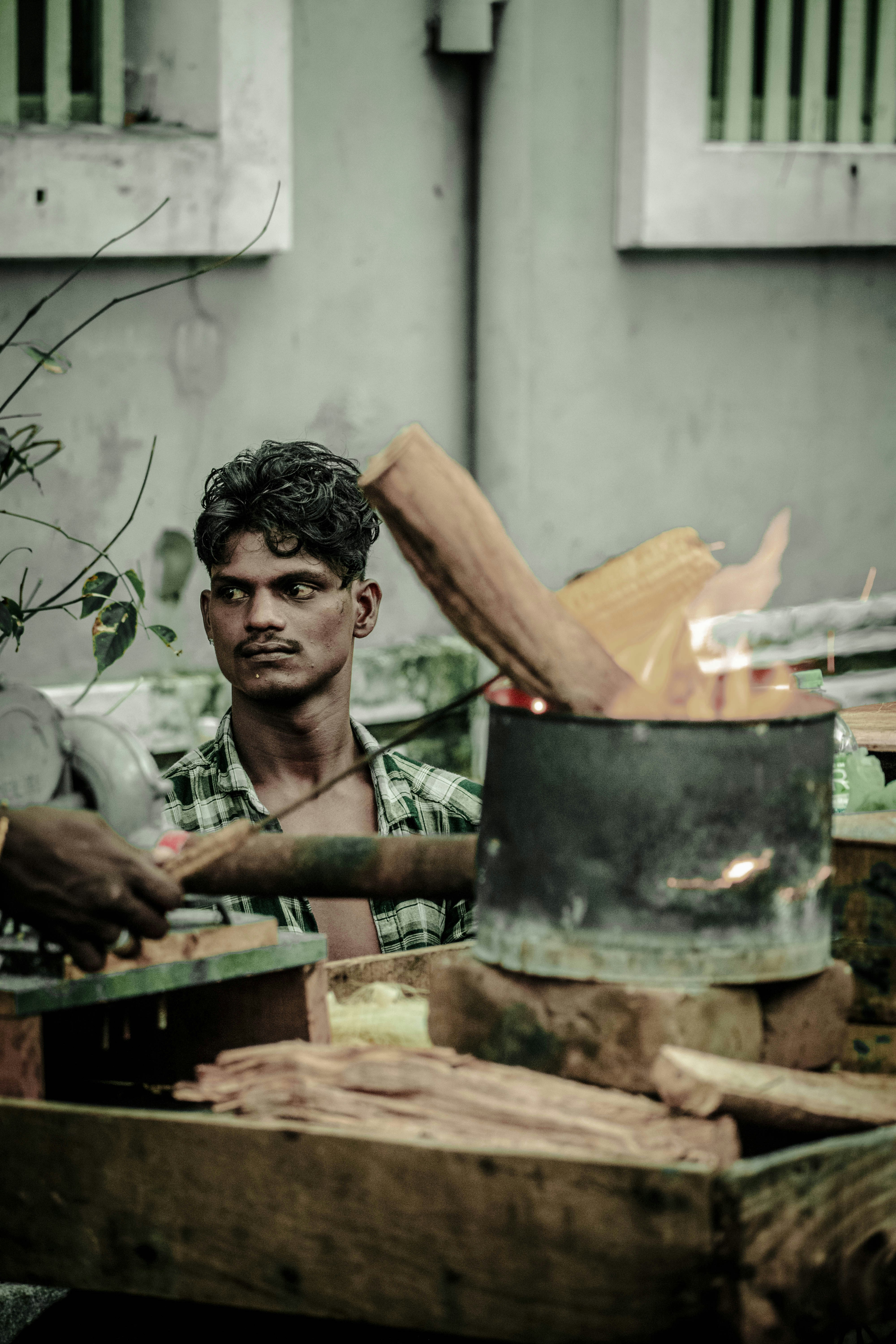 Gas Stove Glow: A Street Vendor Pausing Amid Firelight