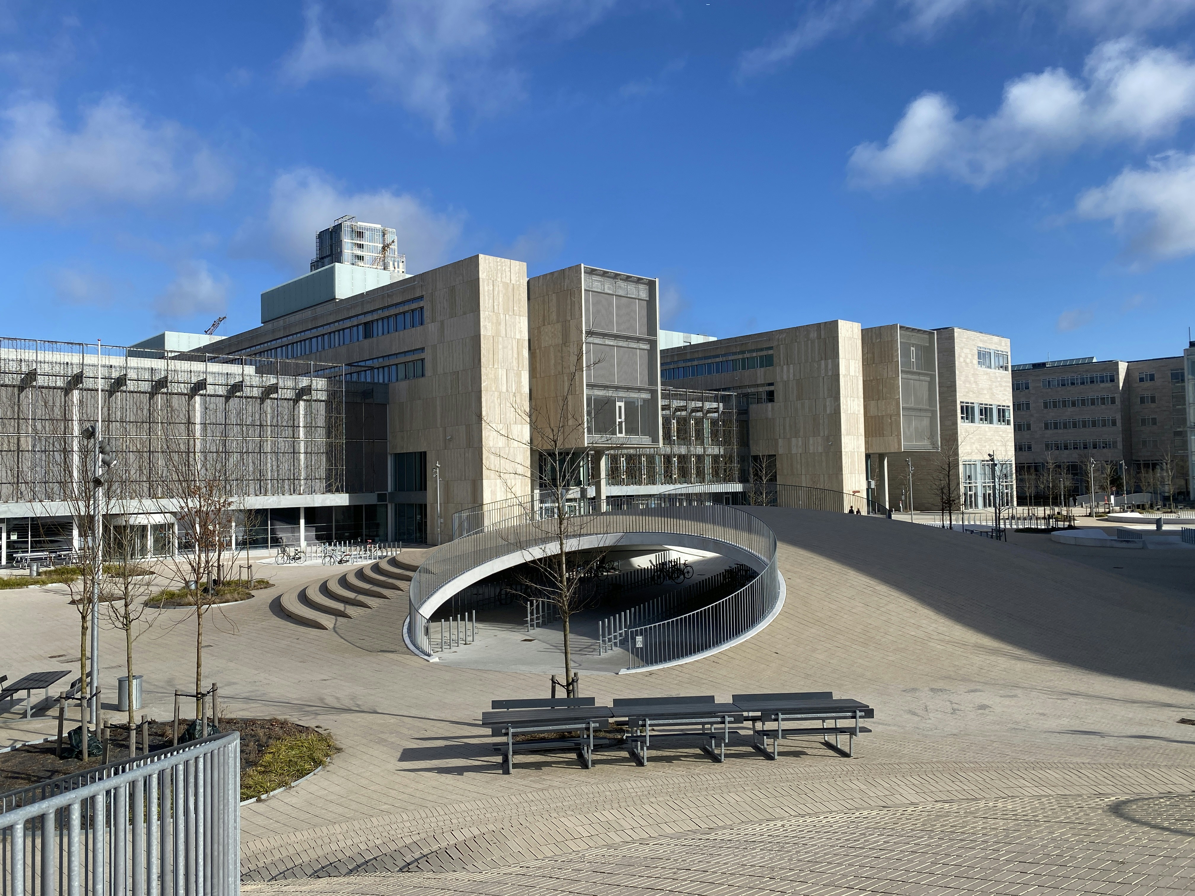 Round glass building near brown concrete building during daytime photo ...