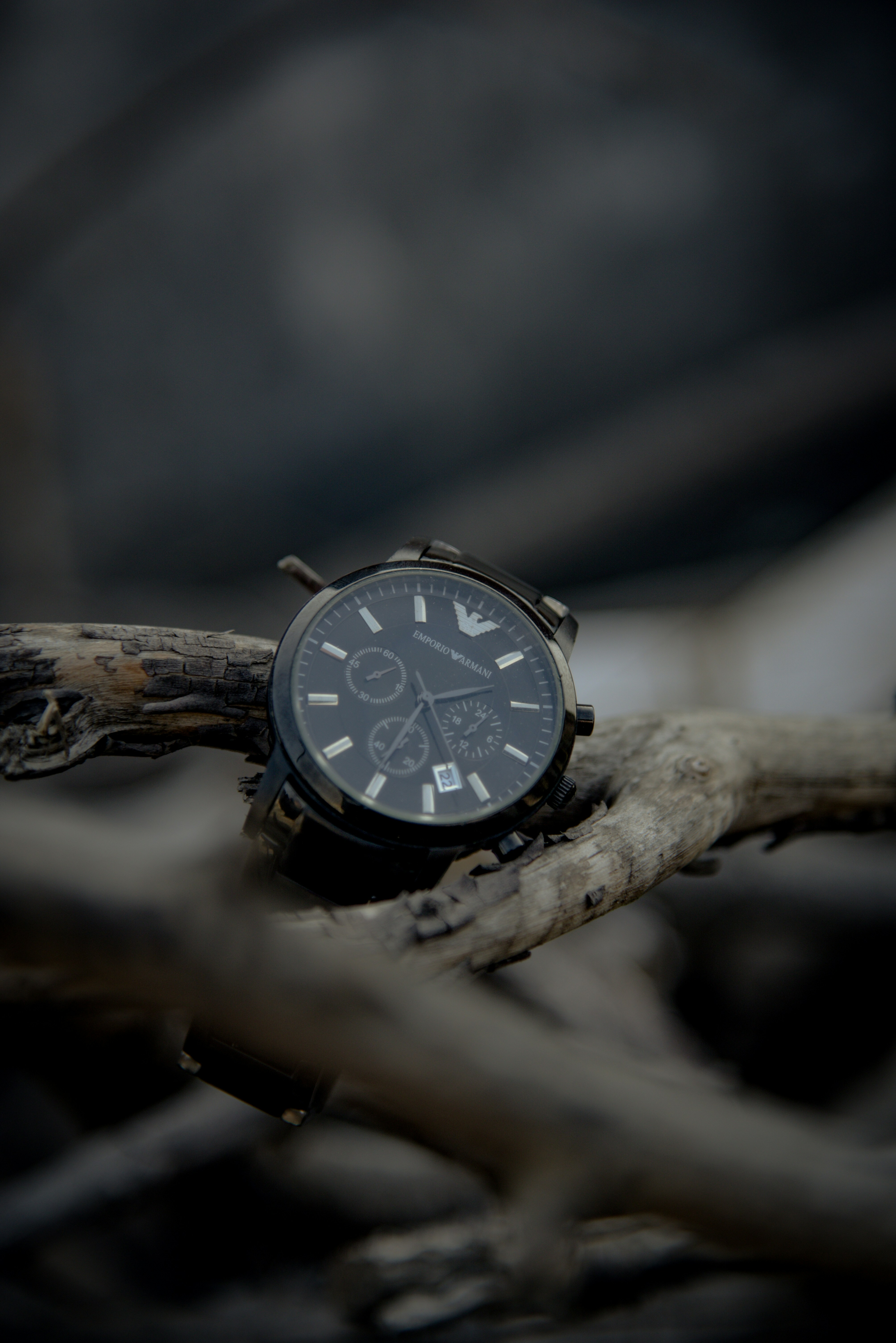 black and silver round analog watch