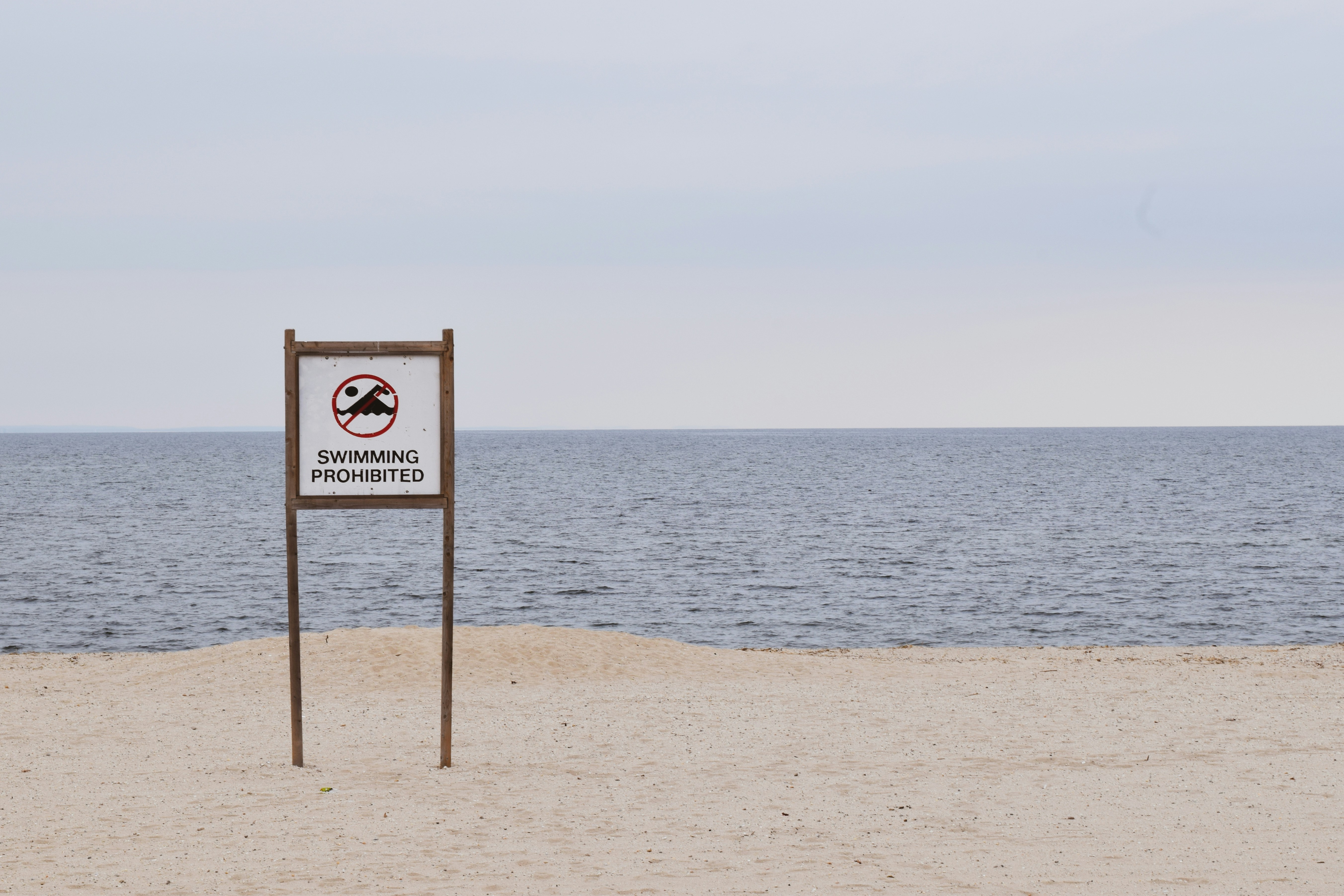 Brown and white beach signage on beach during daytime photo – Free Grey ...