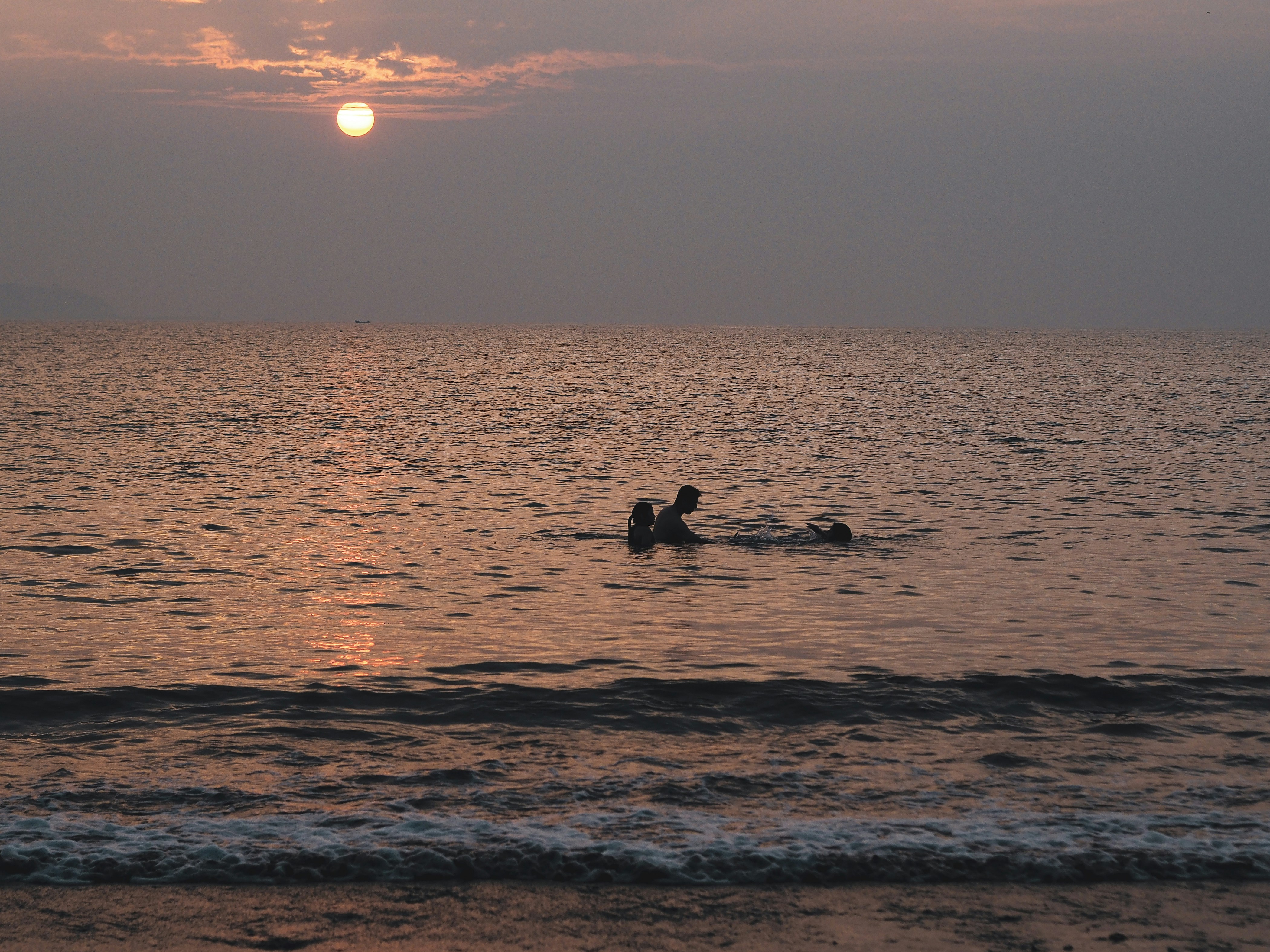 Dusk Silhouettes Over a Quiet Sea