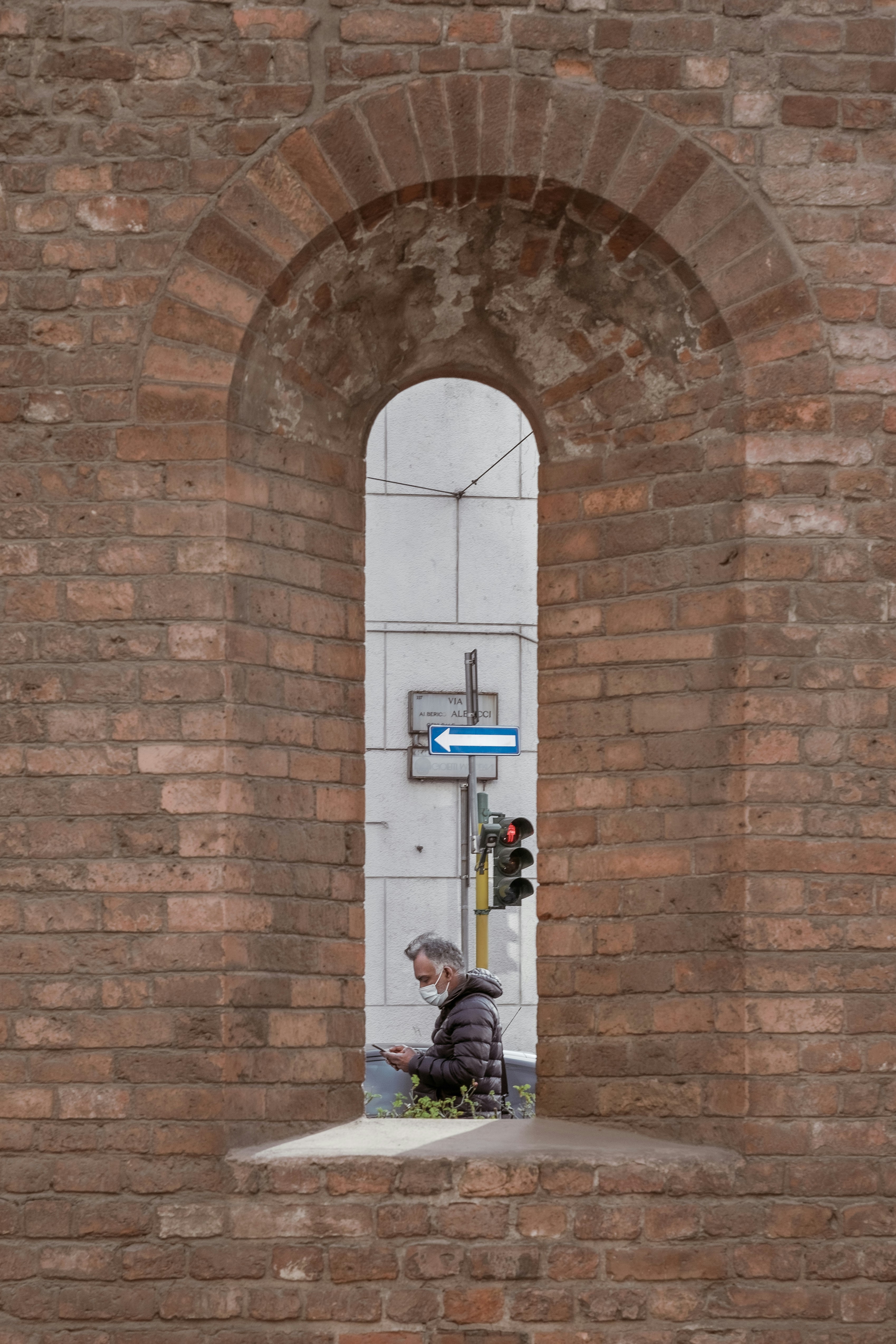 Through the Brick Arch: A Stranger at the Window