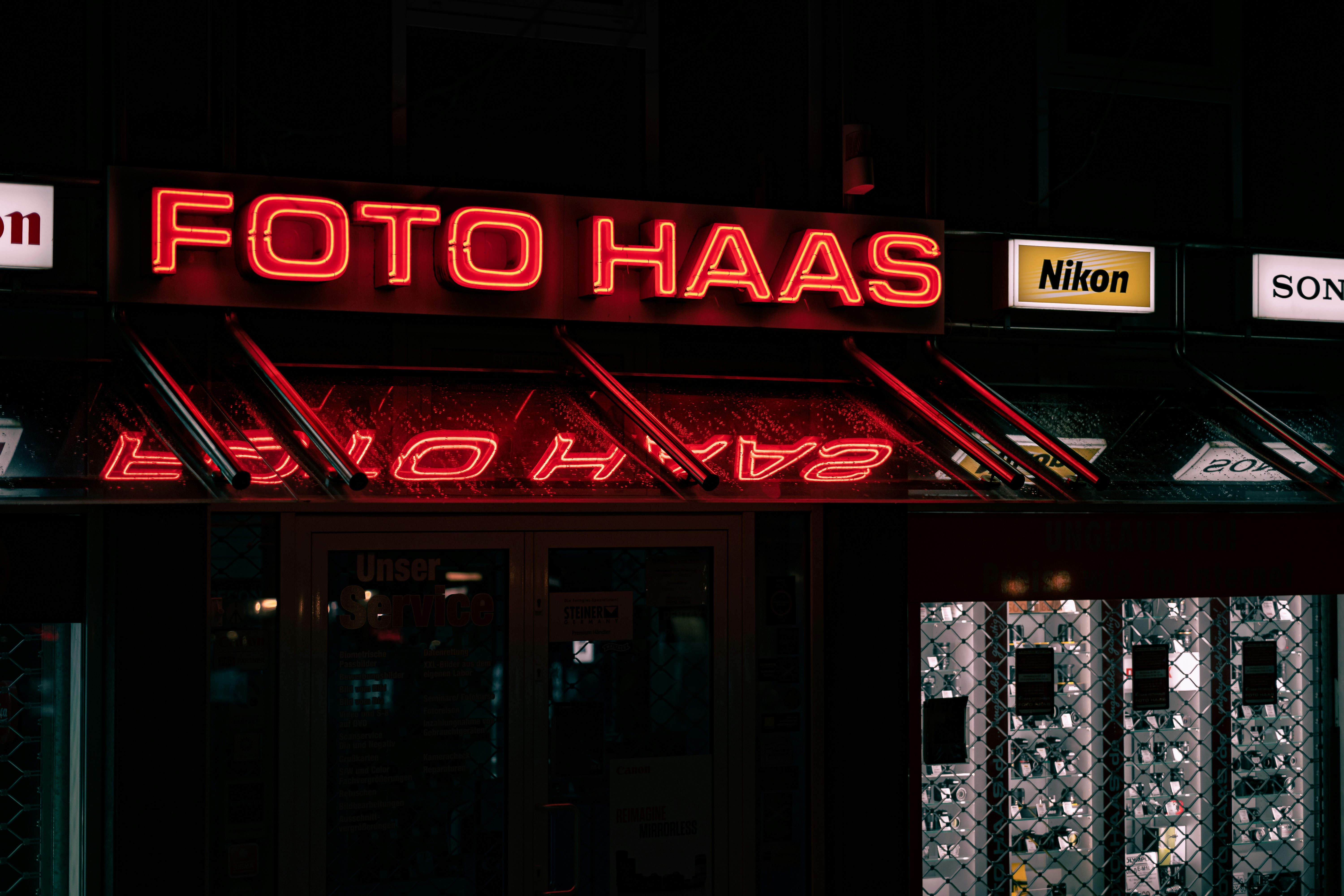 A red neon sign that reads foto haas photo – Free Hannover Image on ...