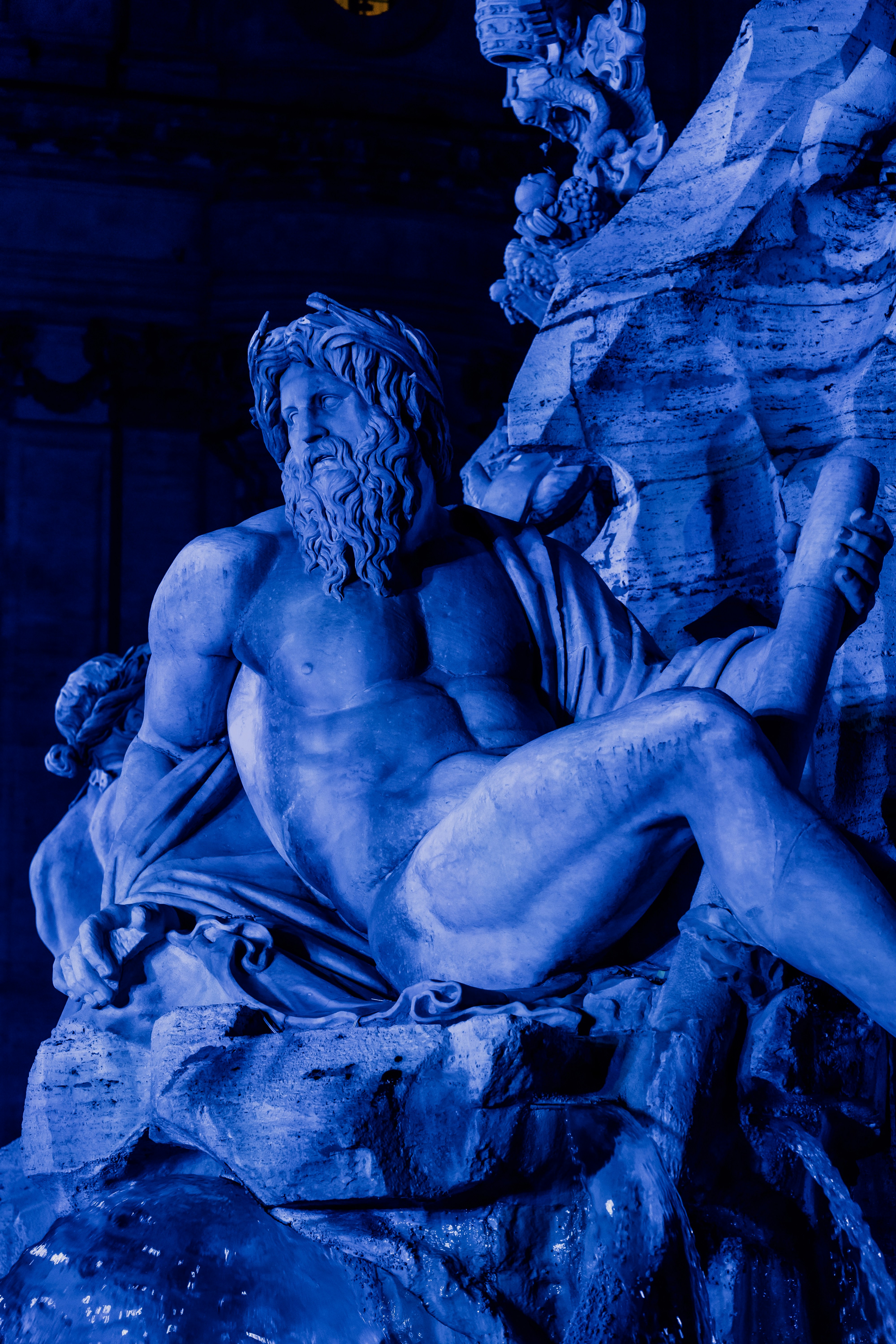 The Fountain of the Four Rivers, Piazza Navona, Rome, Italy | man statue in grayscale photography